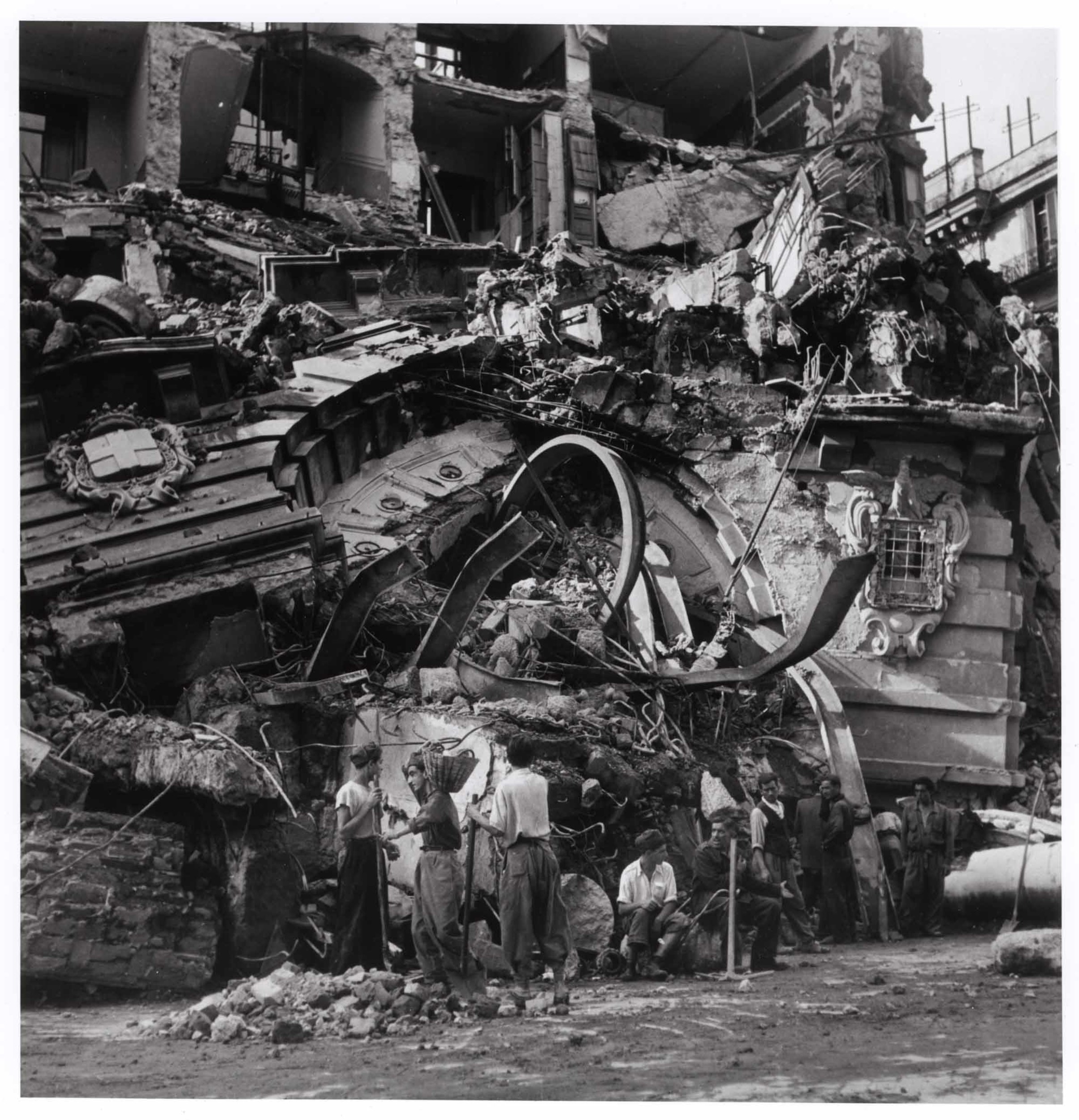 [People in front of the remains of the Central Post Office, where the ...