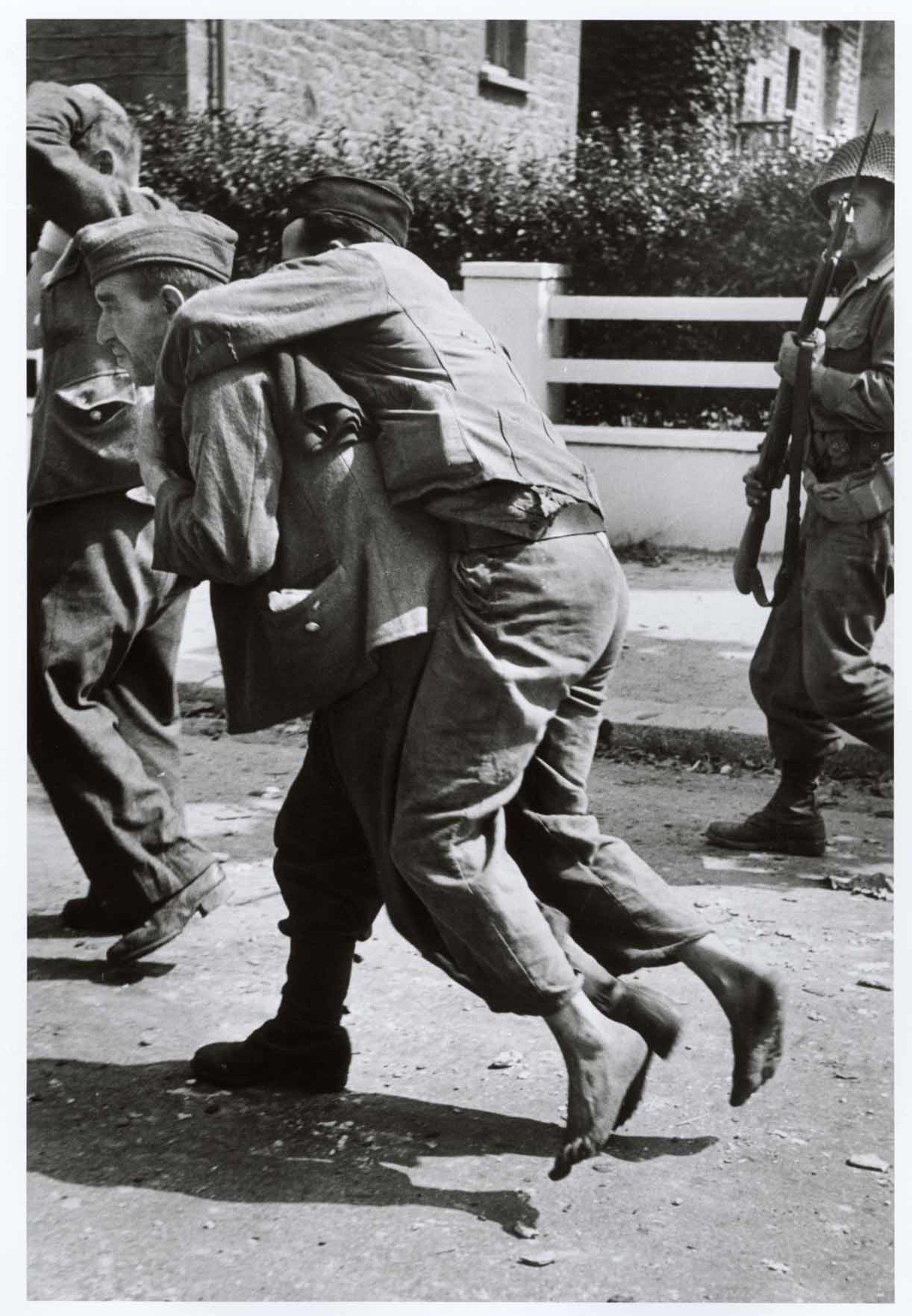 [French prostitute following her captured German customers, Saint-Malo ...