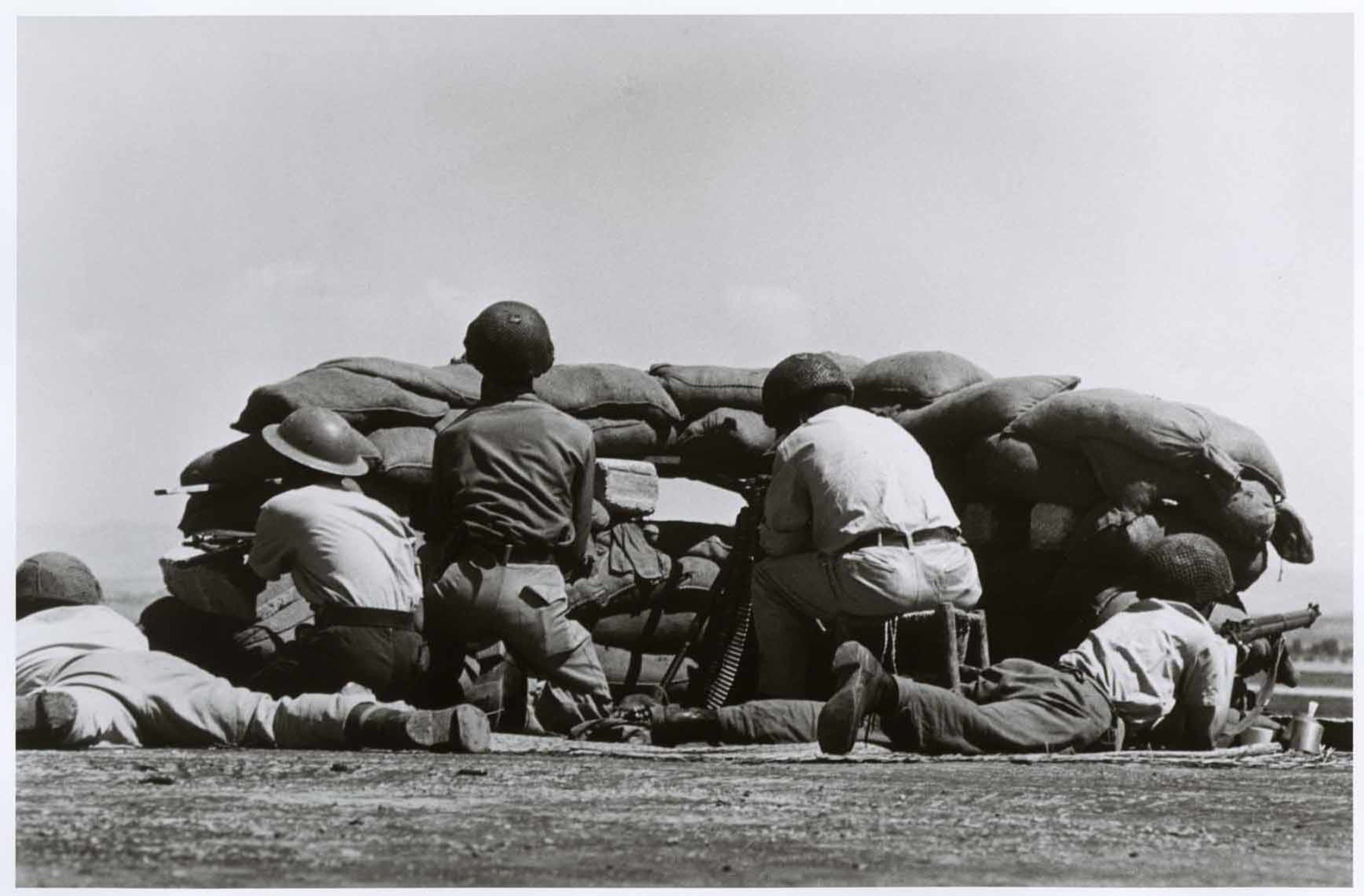 [Soldiers crouch behind sandbags on a rooftop. The war for Israel's ...