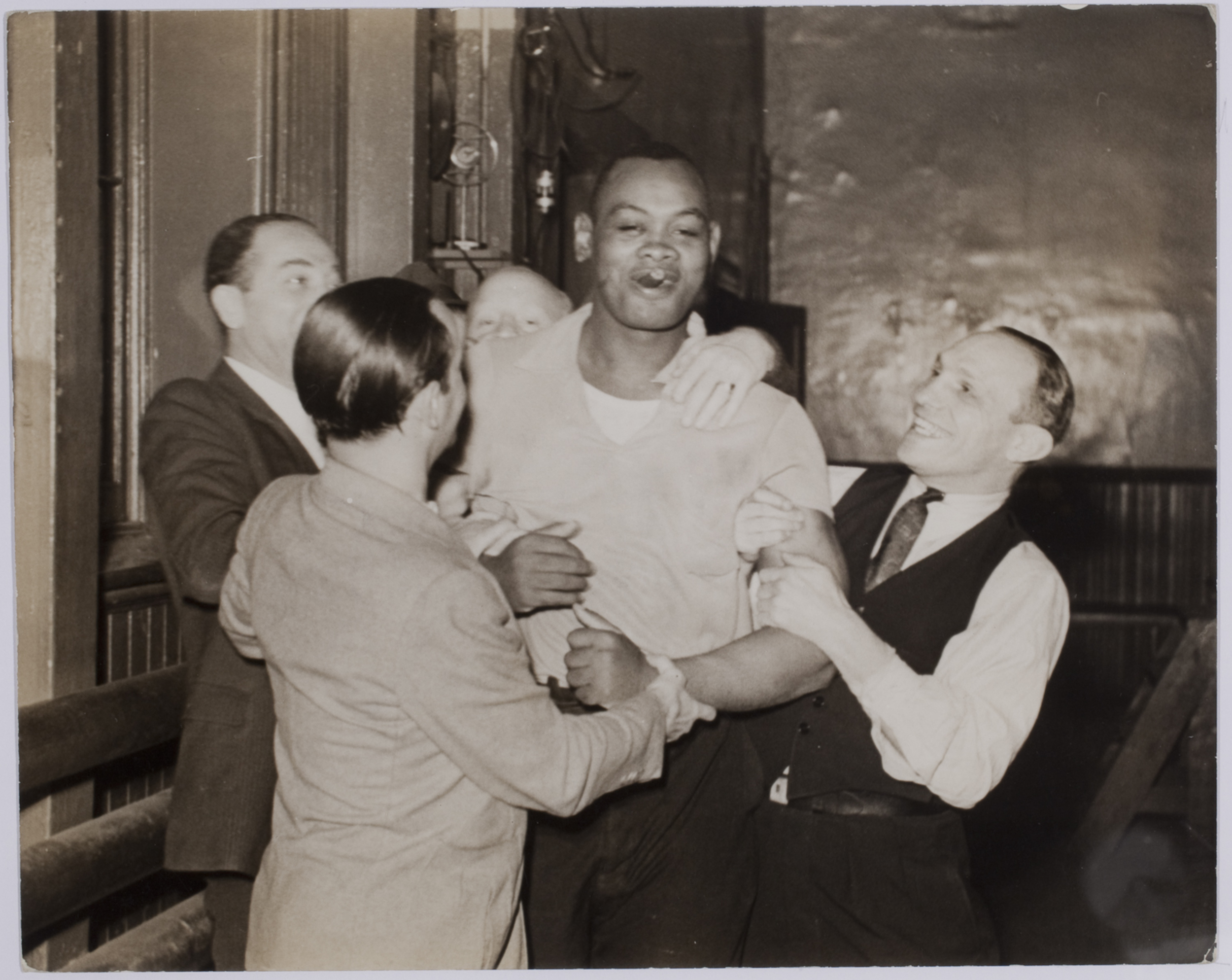[Boxer boxer in street clothes smoking cigar surrounded by ...
