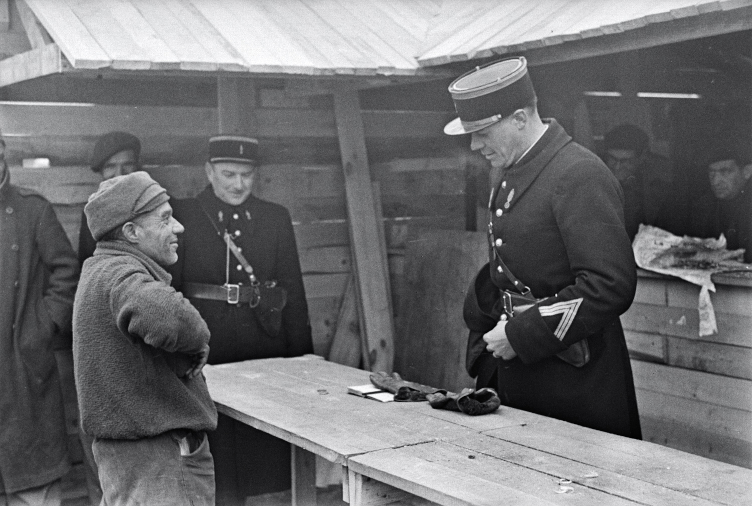 [Older man being inspected by the French police in an internment camp ...