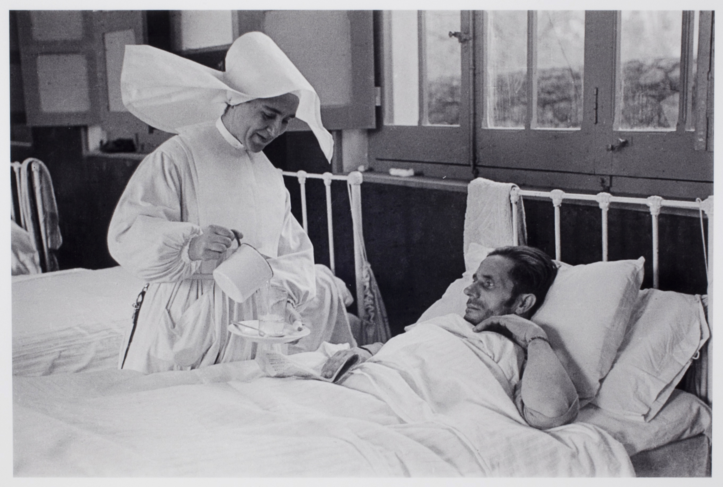 [Nun attending to a patient in a hospital, Lekeitio] | International ...