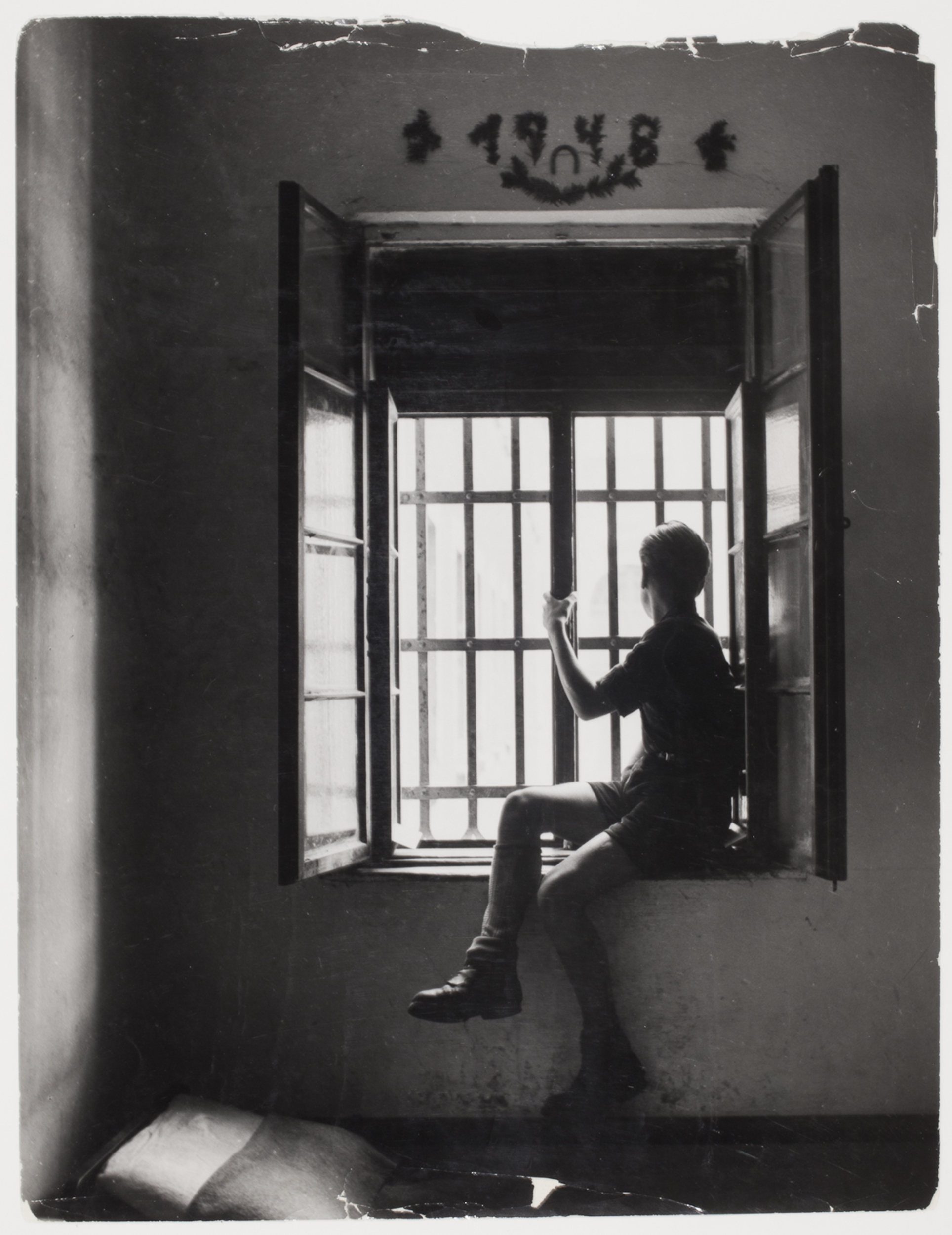 [Boy prisoner in his cell, Vienna] | International Center of Photography