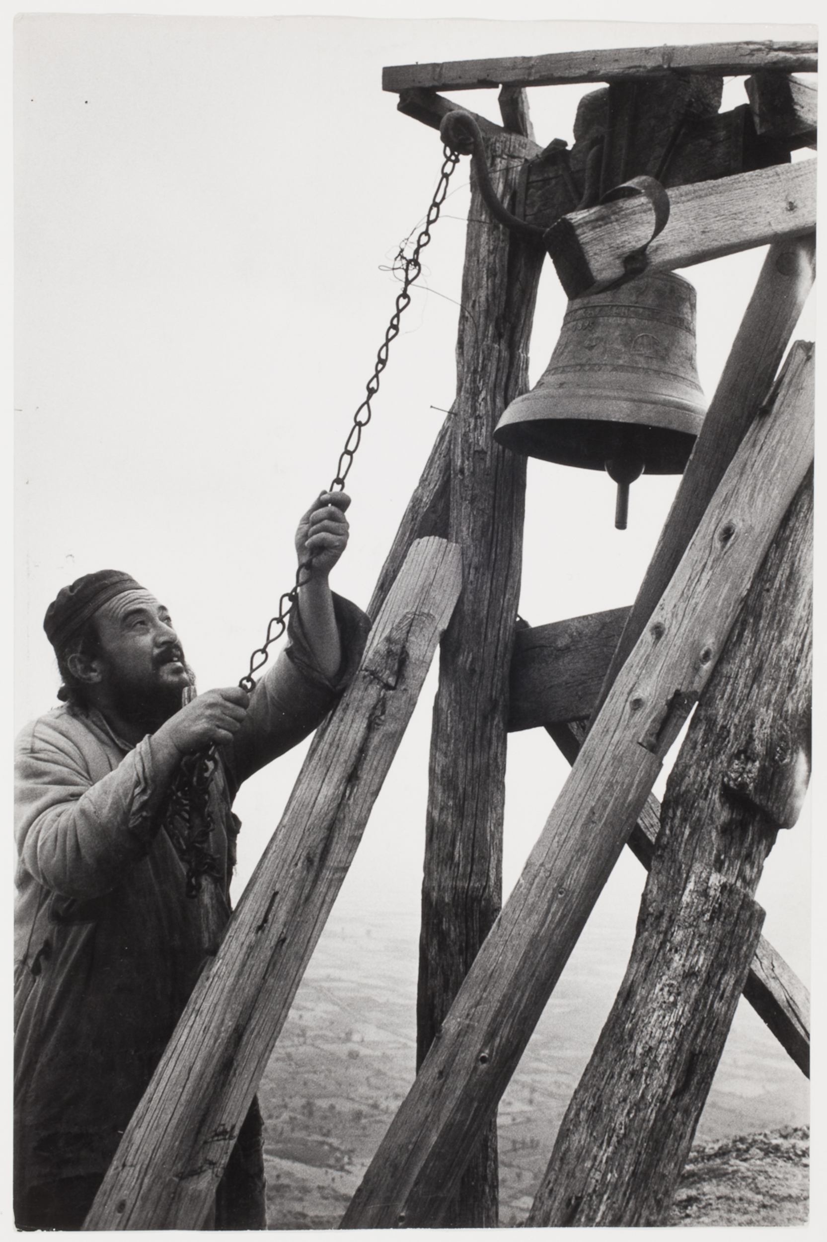 [Man ringing a bell, Greece] | International Center of Photography