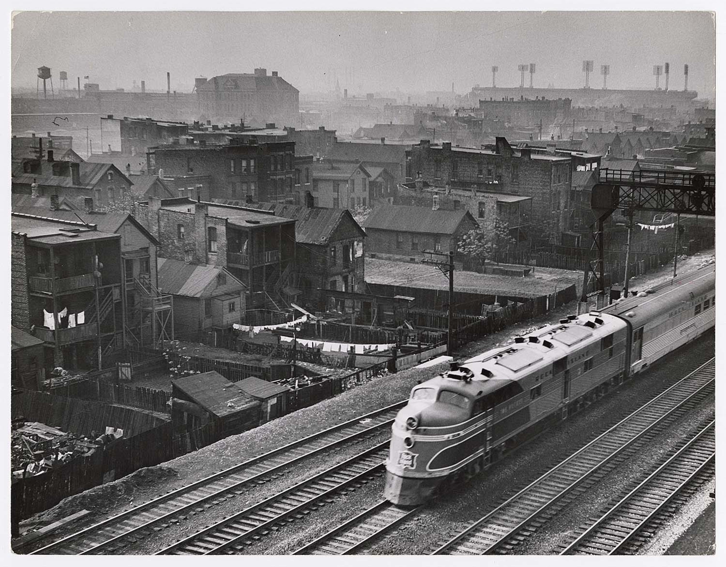 [Train moving past trackside tenement slums of Chicago] | International ...