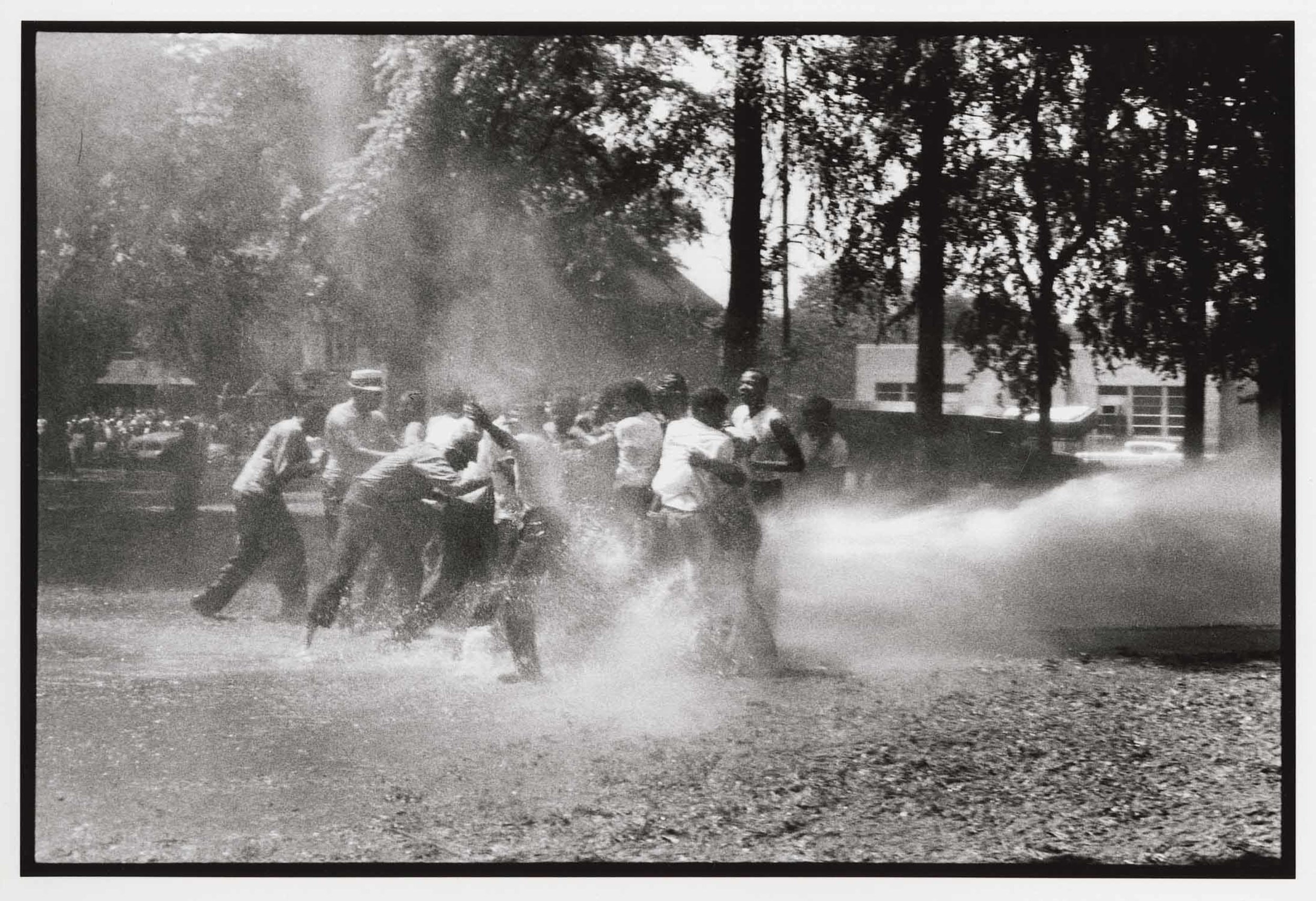 [Firemen control a crowd of demonstrators with high pressure water ...