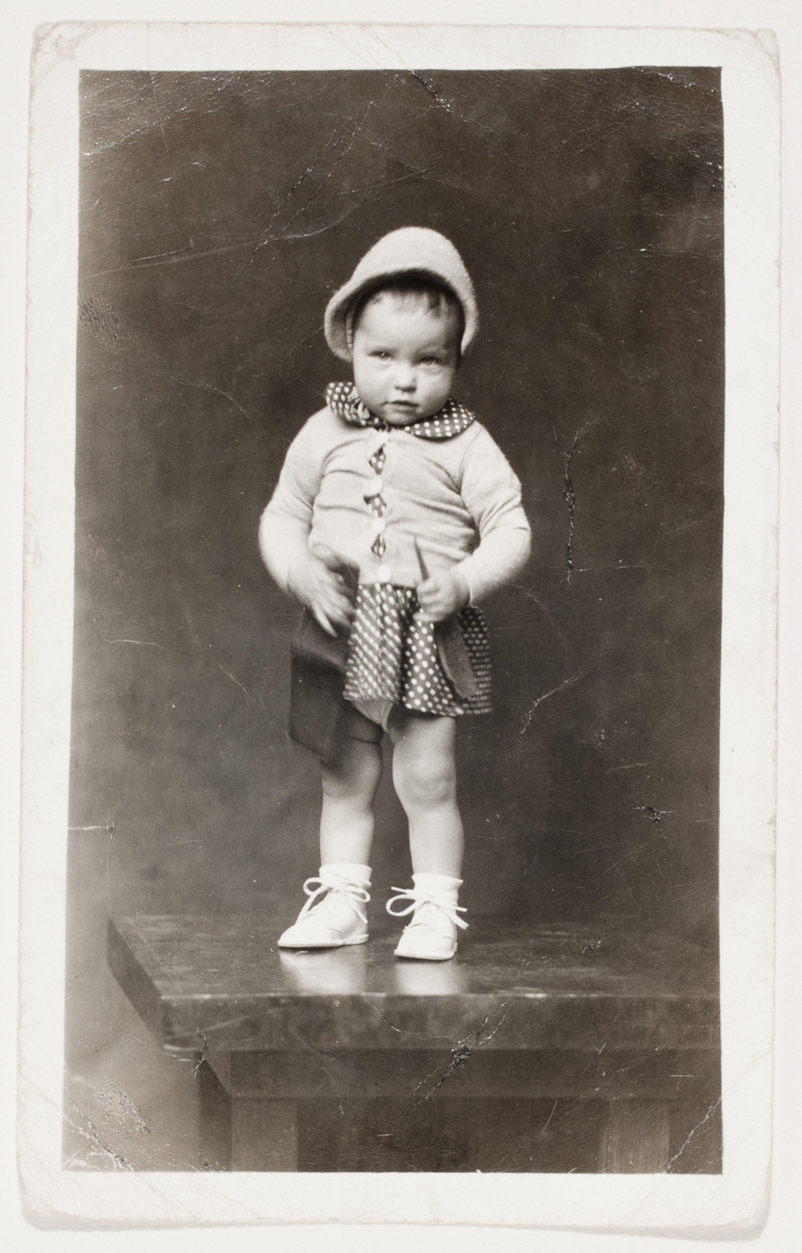 [Unidentified Child on Table] | International Center of Photography