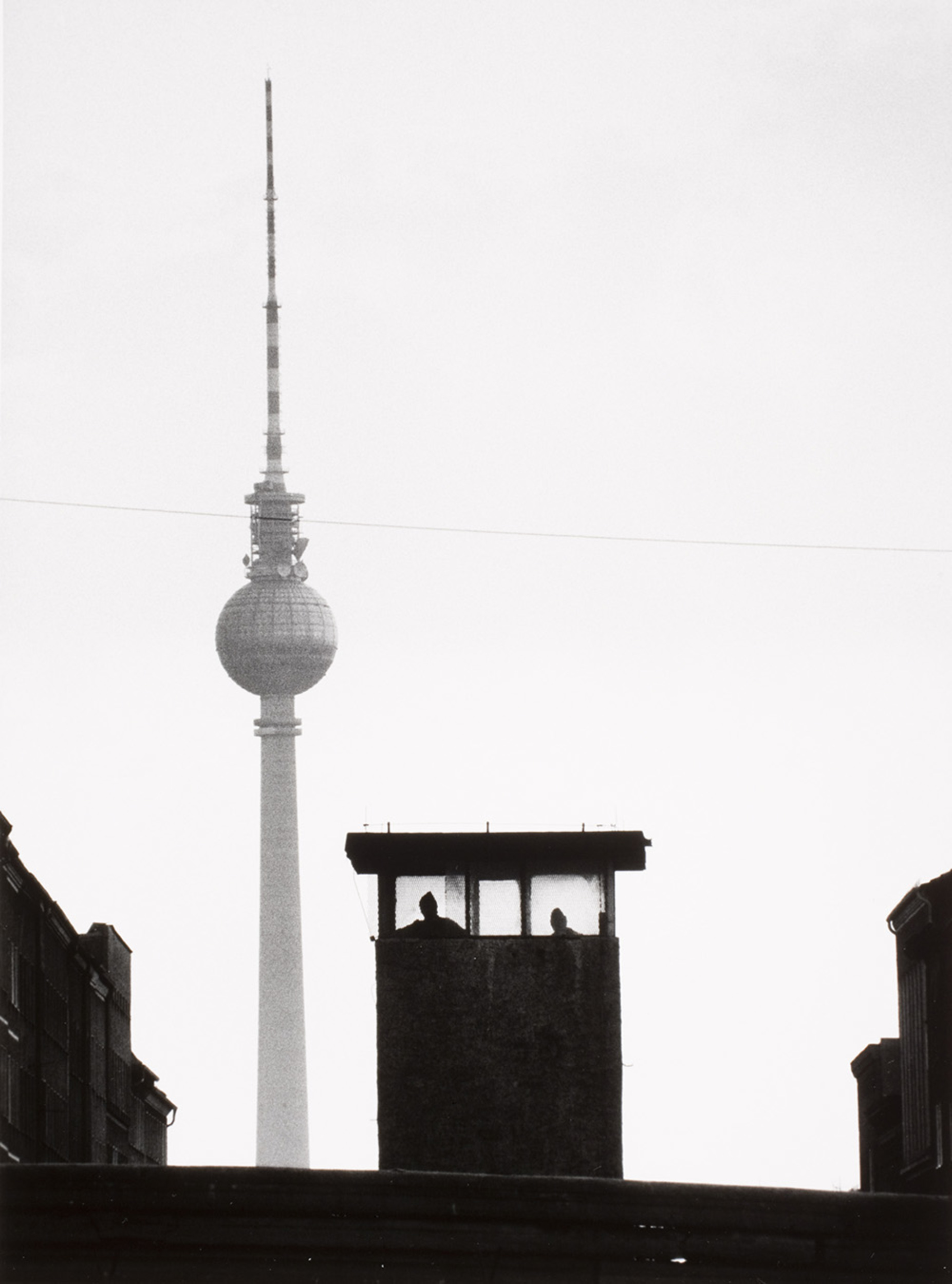 Watchtower manned by East German guards and television tower ...