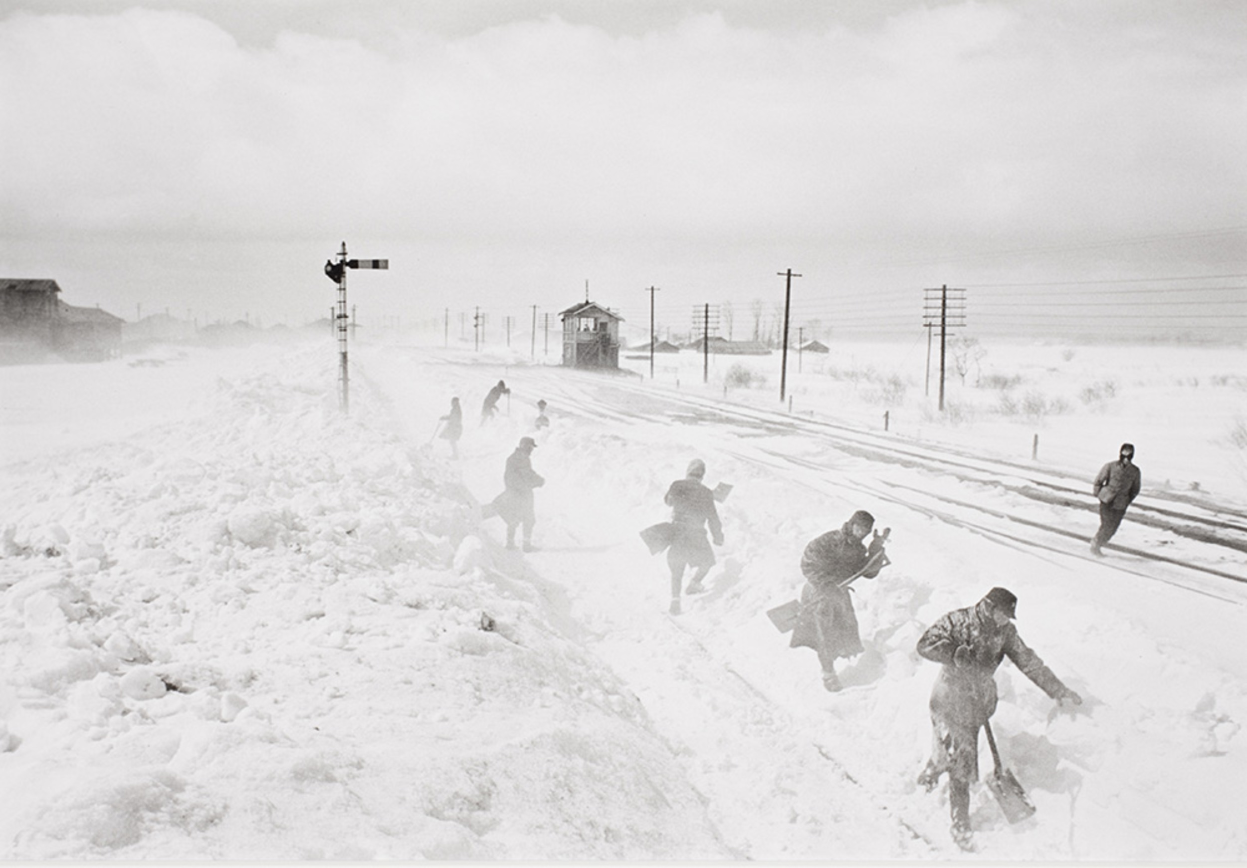 Railroad crew clearing tracks near Sapporo, Hokkaido, Japan, after a ...