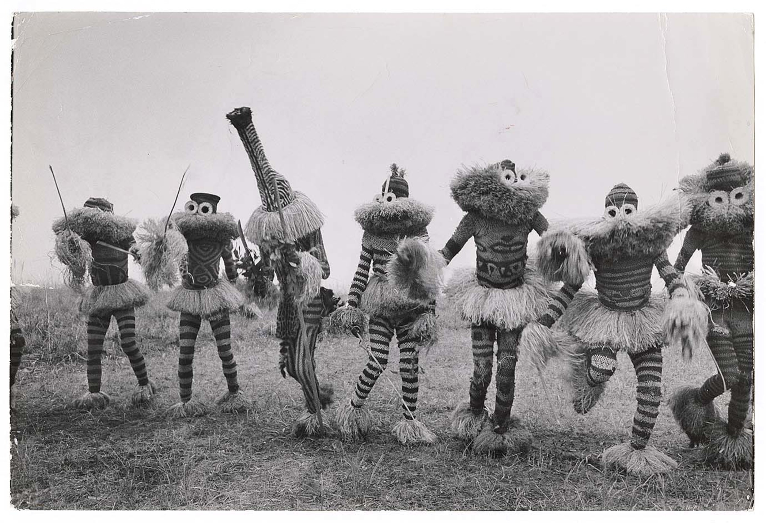 [Boende tribesmen of Western Congo wearing costumes of fiber performing ...