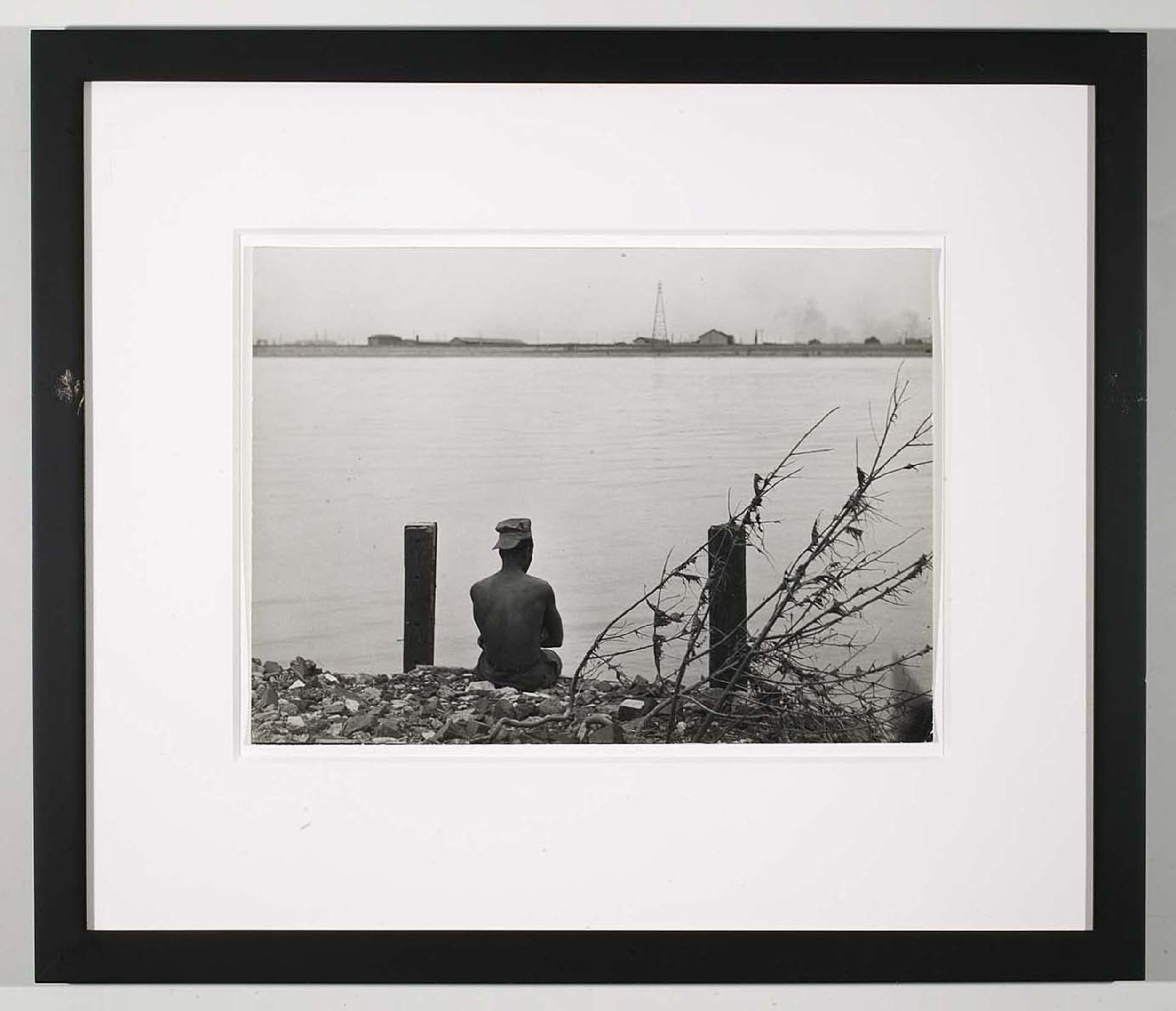 St. Louis, man sitting by River | International Center of Photography