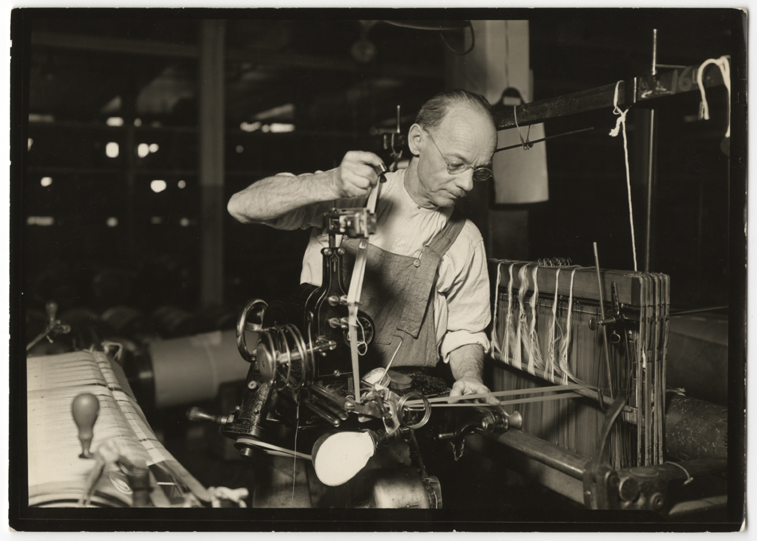 [Worker setting up twisting-in machine, William Skinner and Sons ...