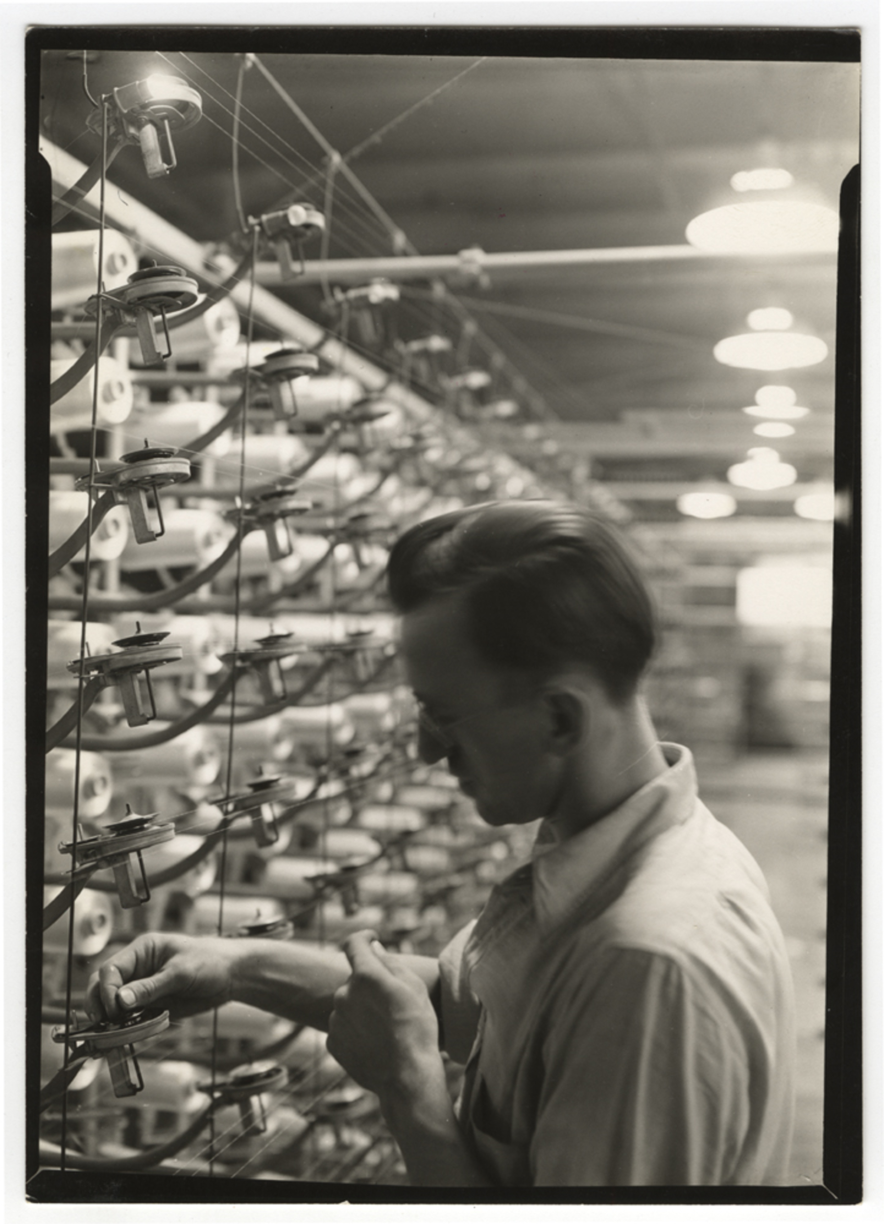 [Worker warping rayon on cone creel, William Skinner and Sons, Holyoke ...