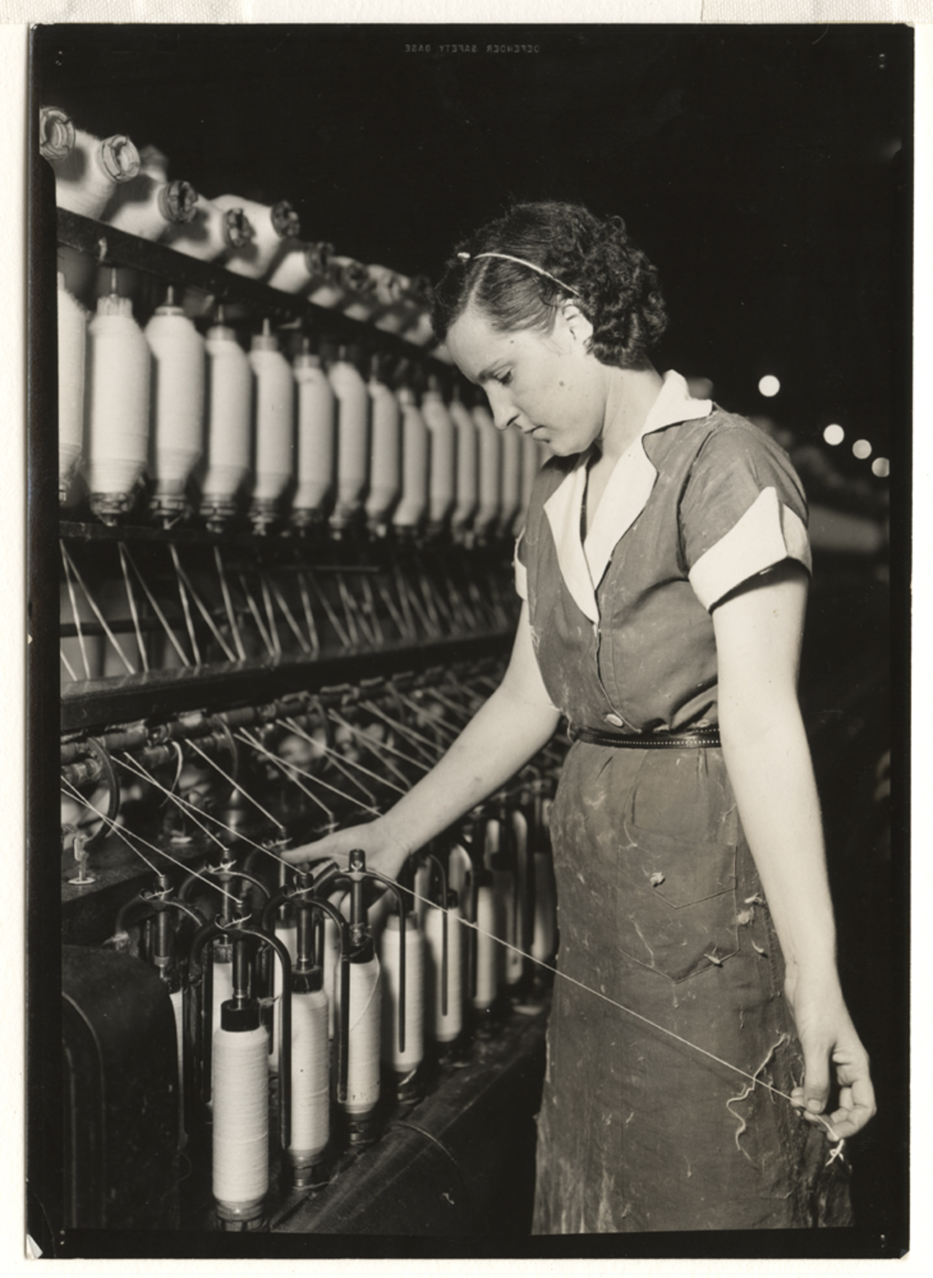 [Highly-skilled doffer putting up ends, Pickett Yarn Mill, High Point ...