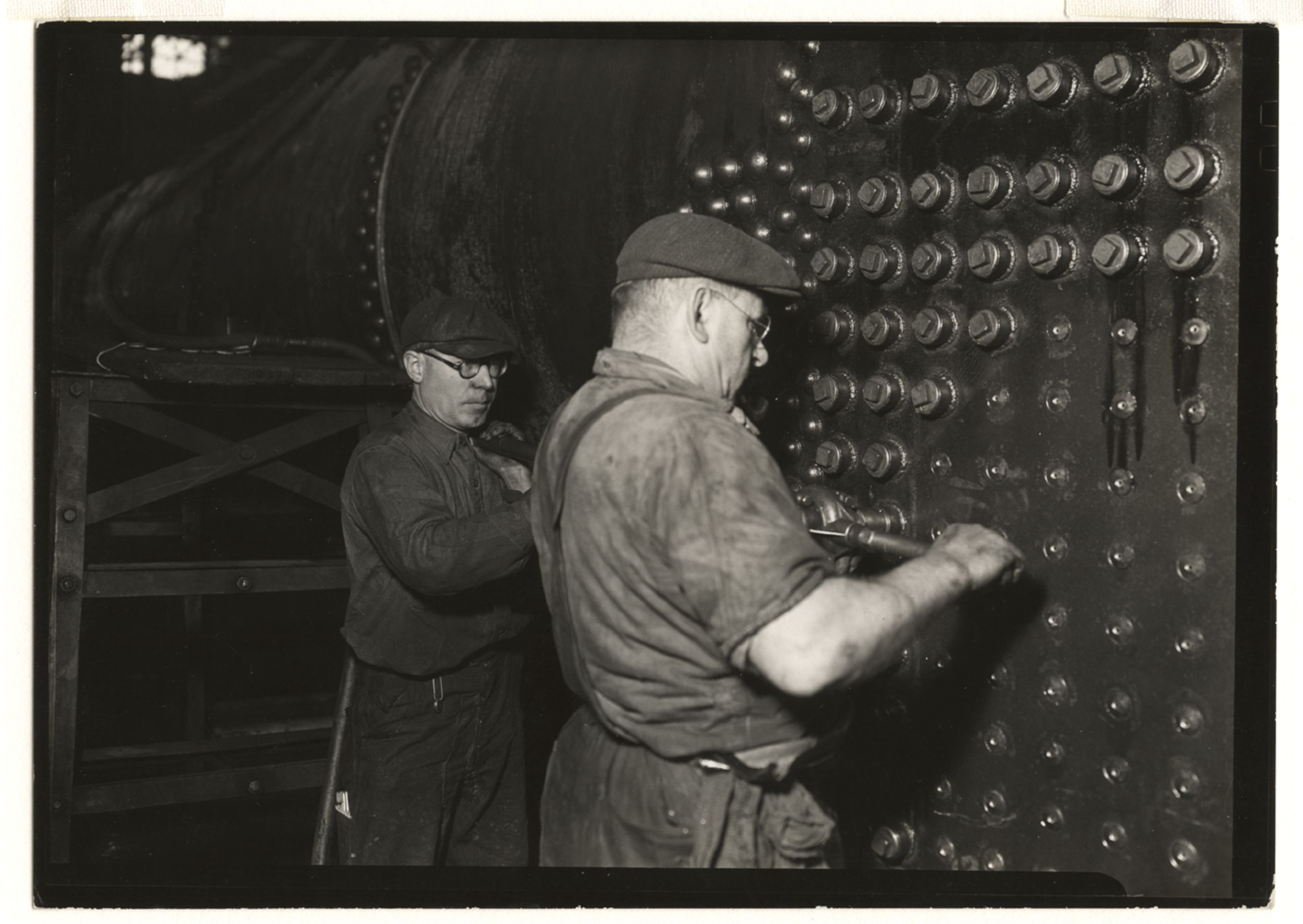 [Boilermaker and helper working on locomotive boiler, Baldwin ...