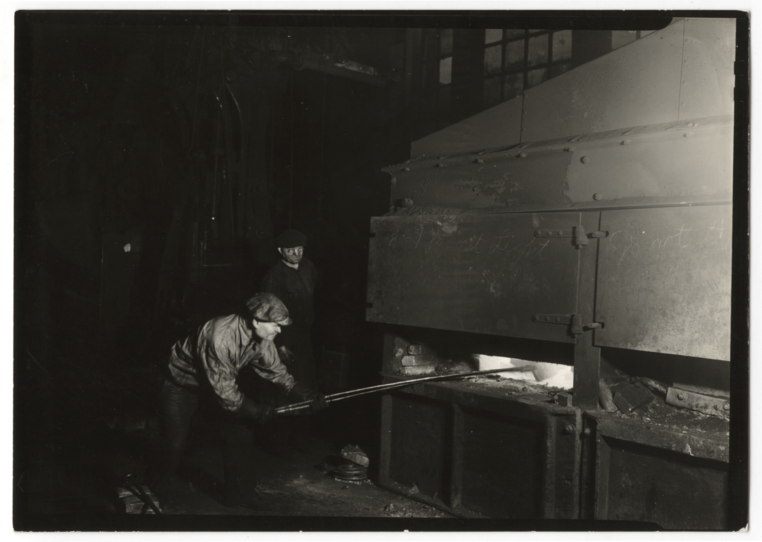 [Blacksmith and helper working on modern forge in smith's shop, Baldwin ...