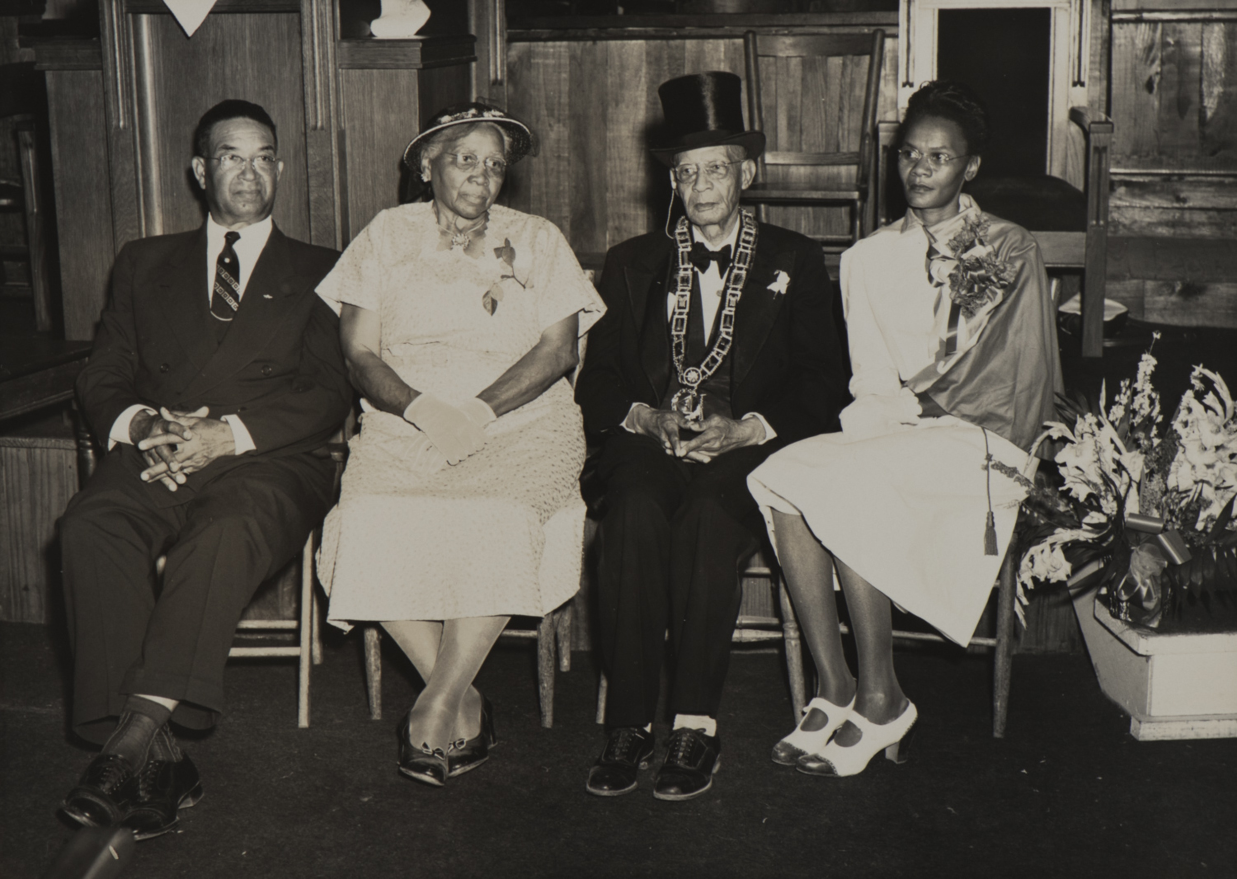 [Men and women, including Helen Jordan (right), gathering at an awards ...