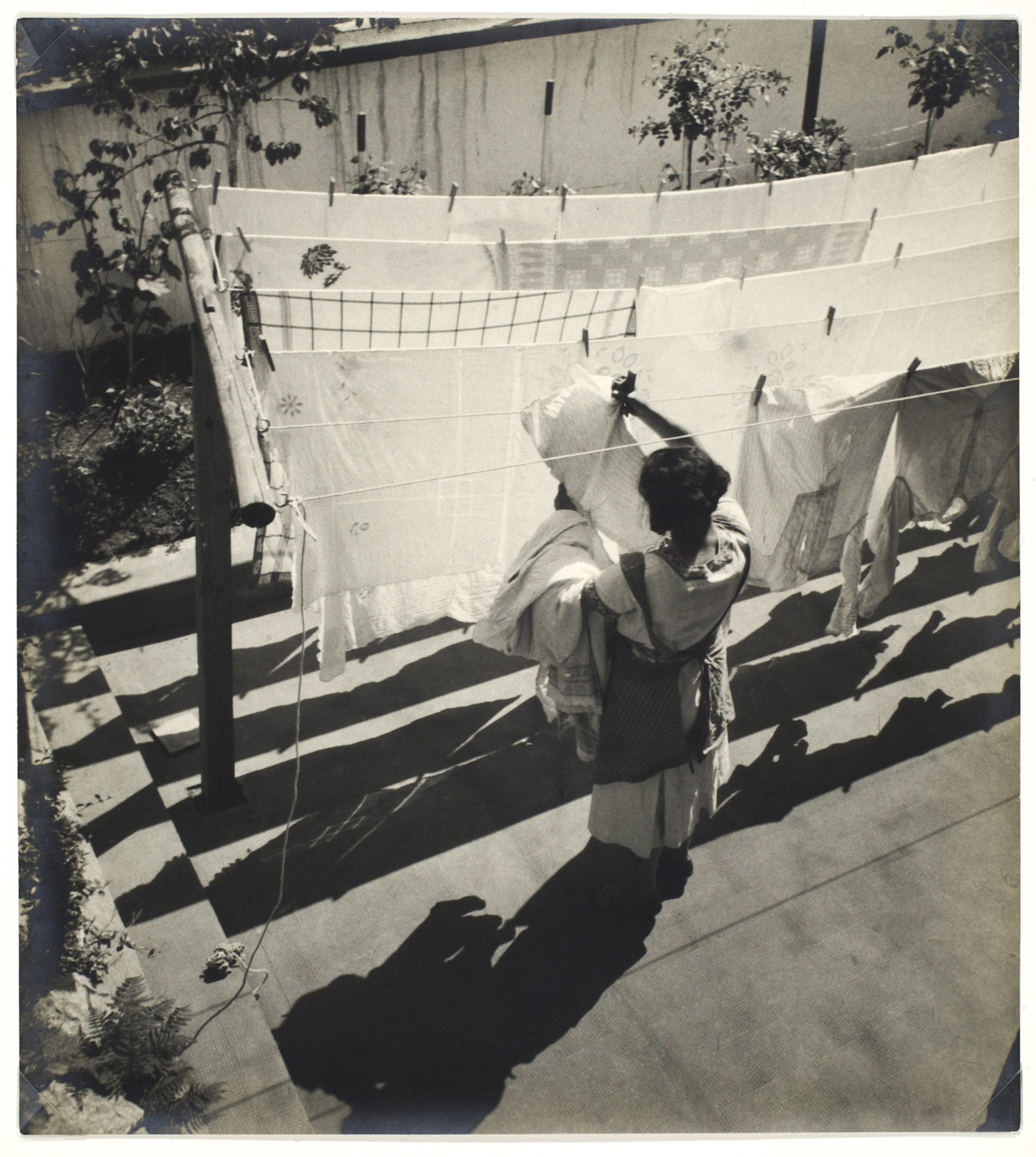 [Woman hanging laundry on clothesline] | International Center of ...