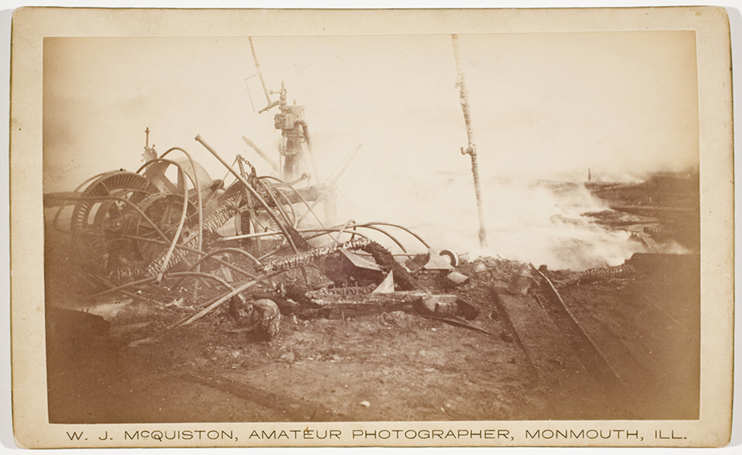 [Charred and Smoldering Remains of Burned Farm Equipment ...
