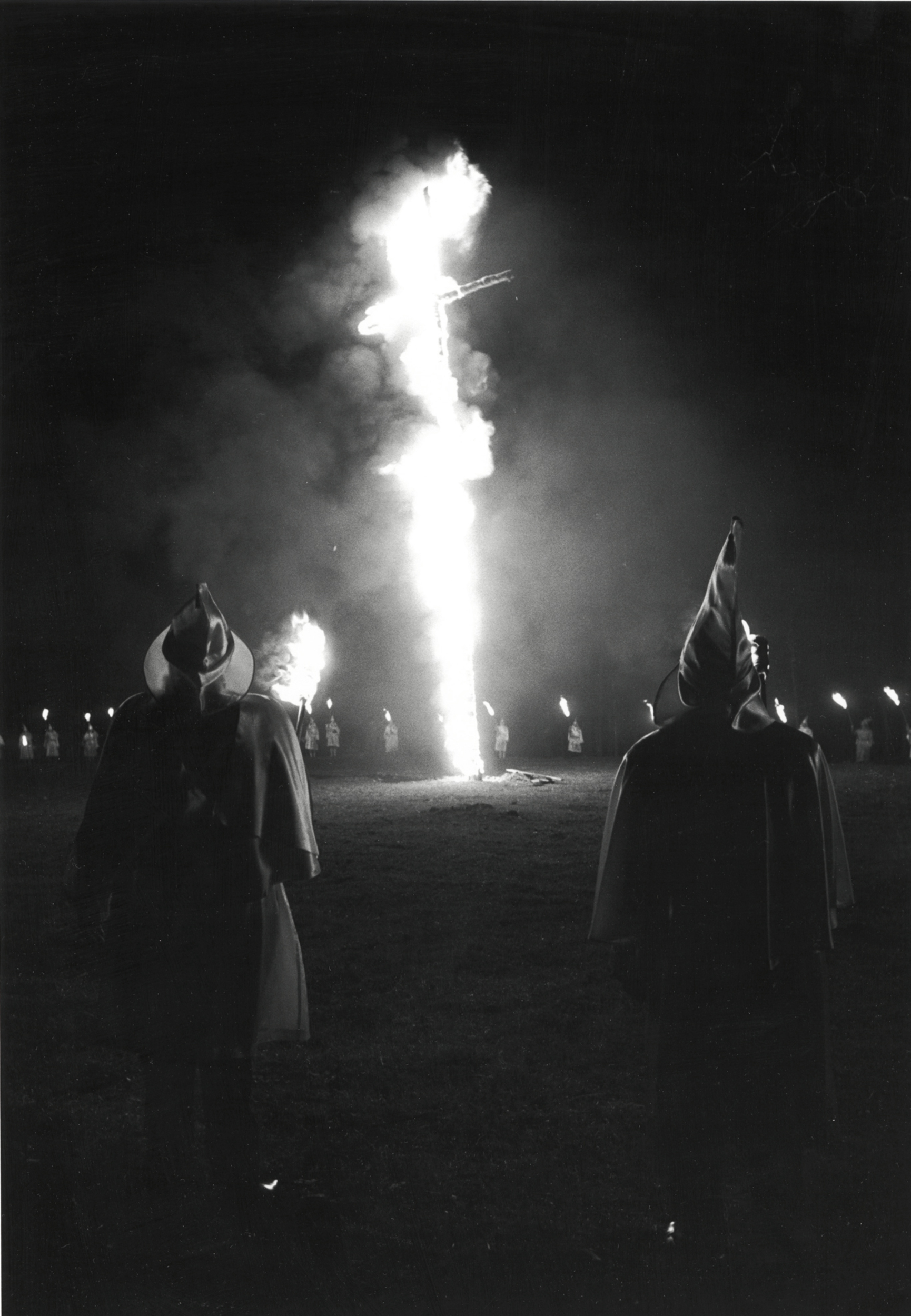 [Ku Klux Klan members circling burning cross at rally, near Salisbury ...