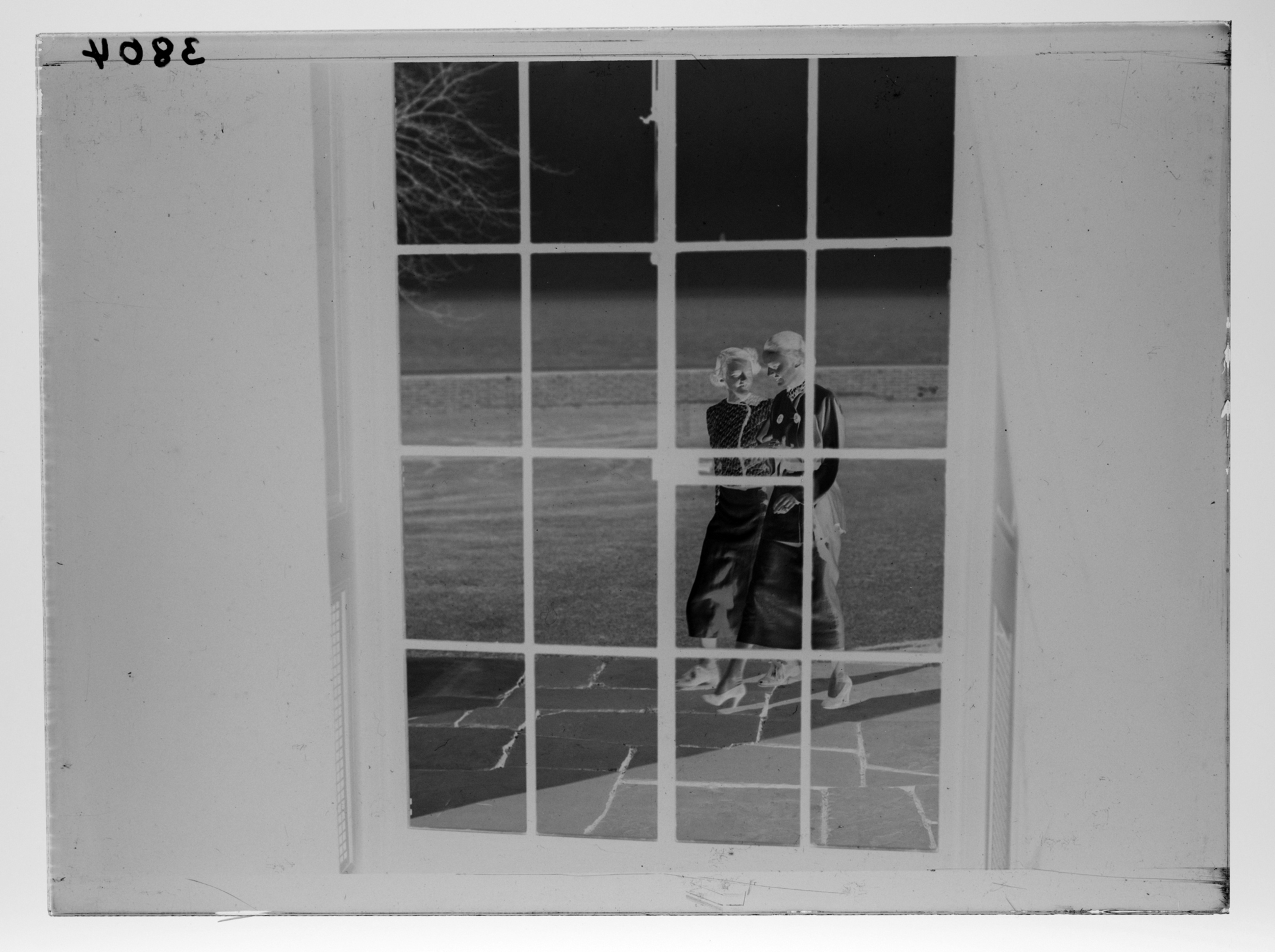 [View through window of two women walking] | International Center of ...