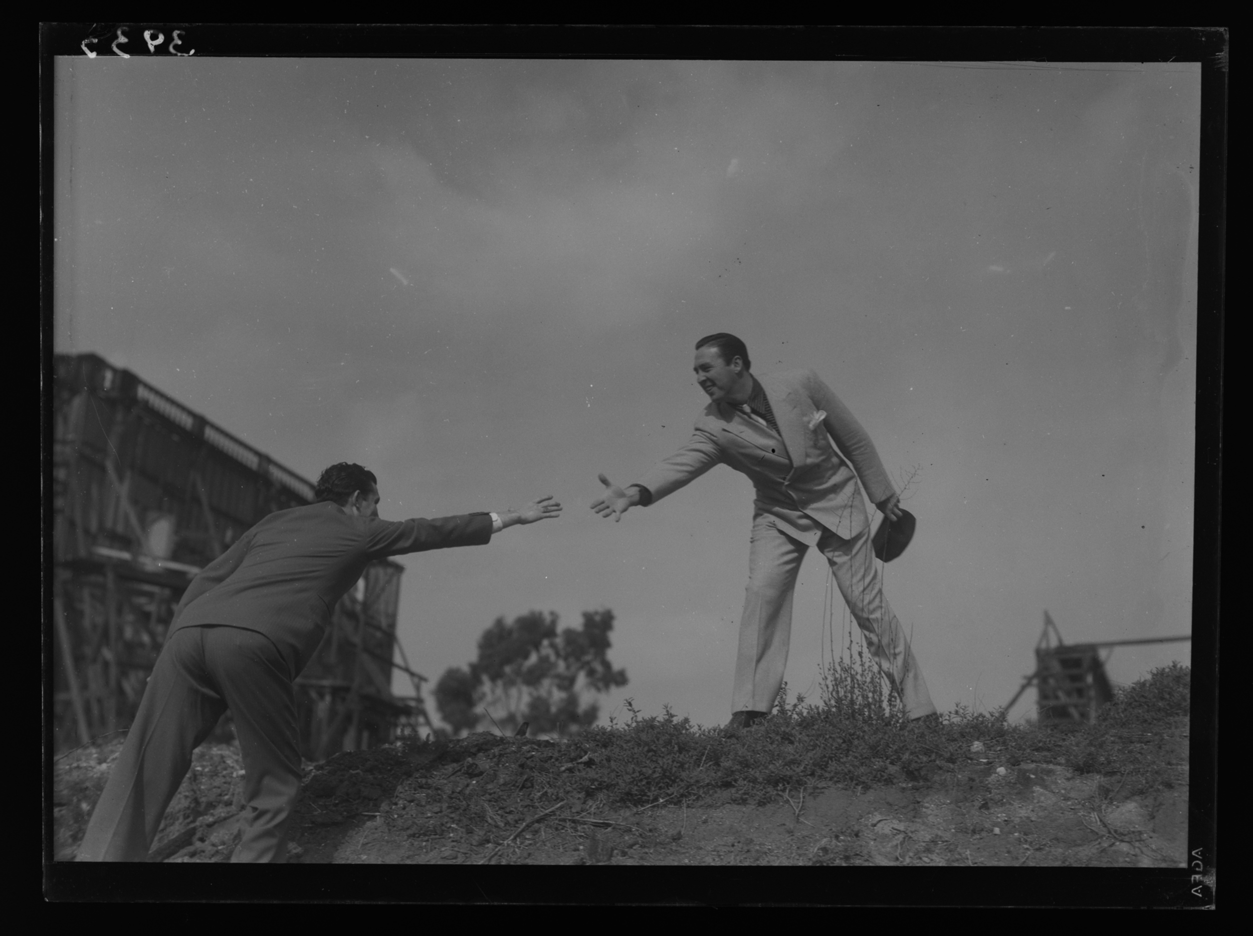 [Man reaching out to help another man] | International Center of ...