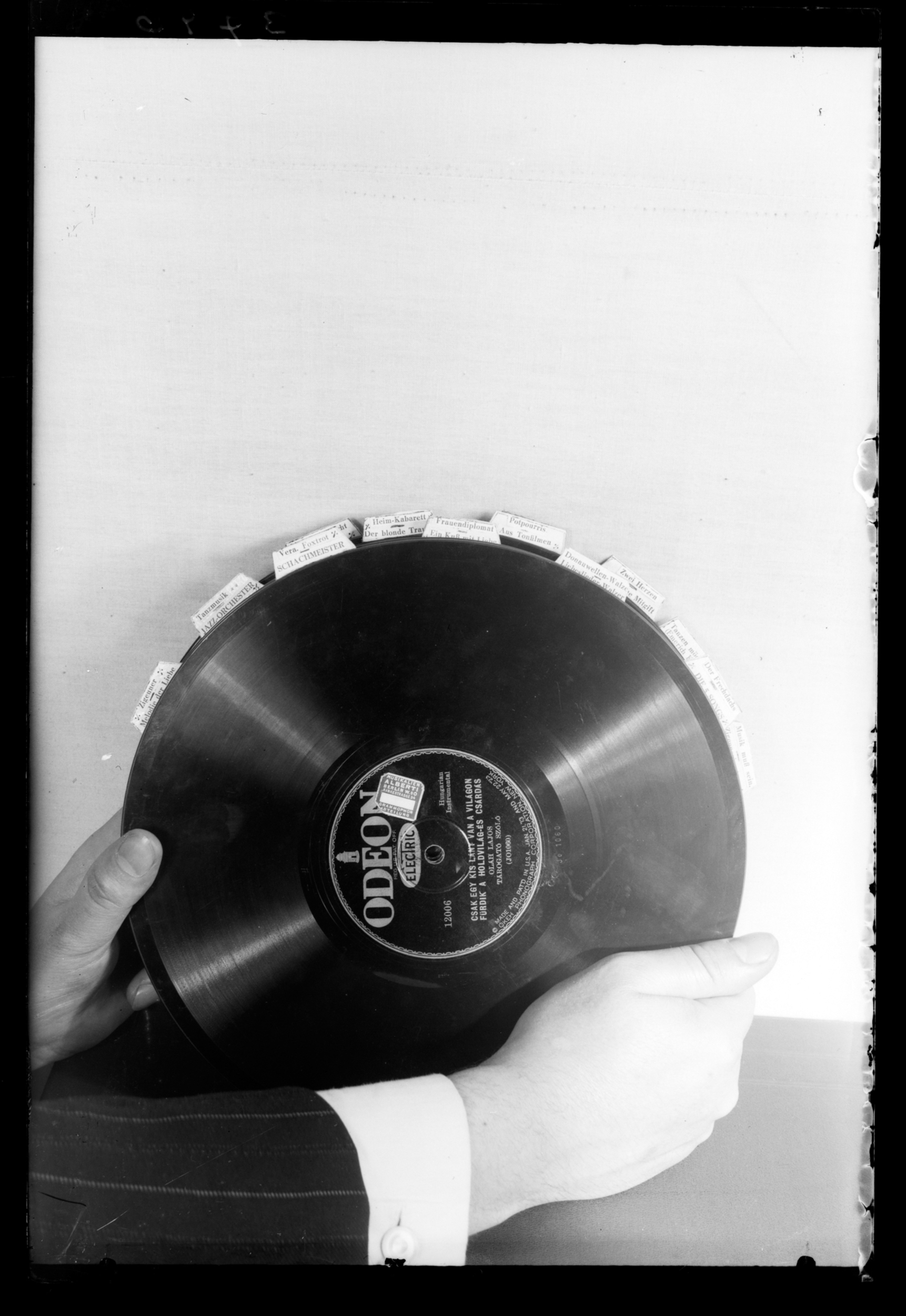 [Man holding records] | International Center of Photography