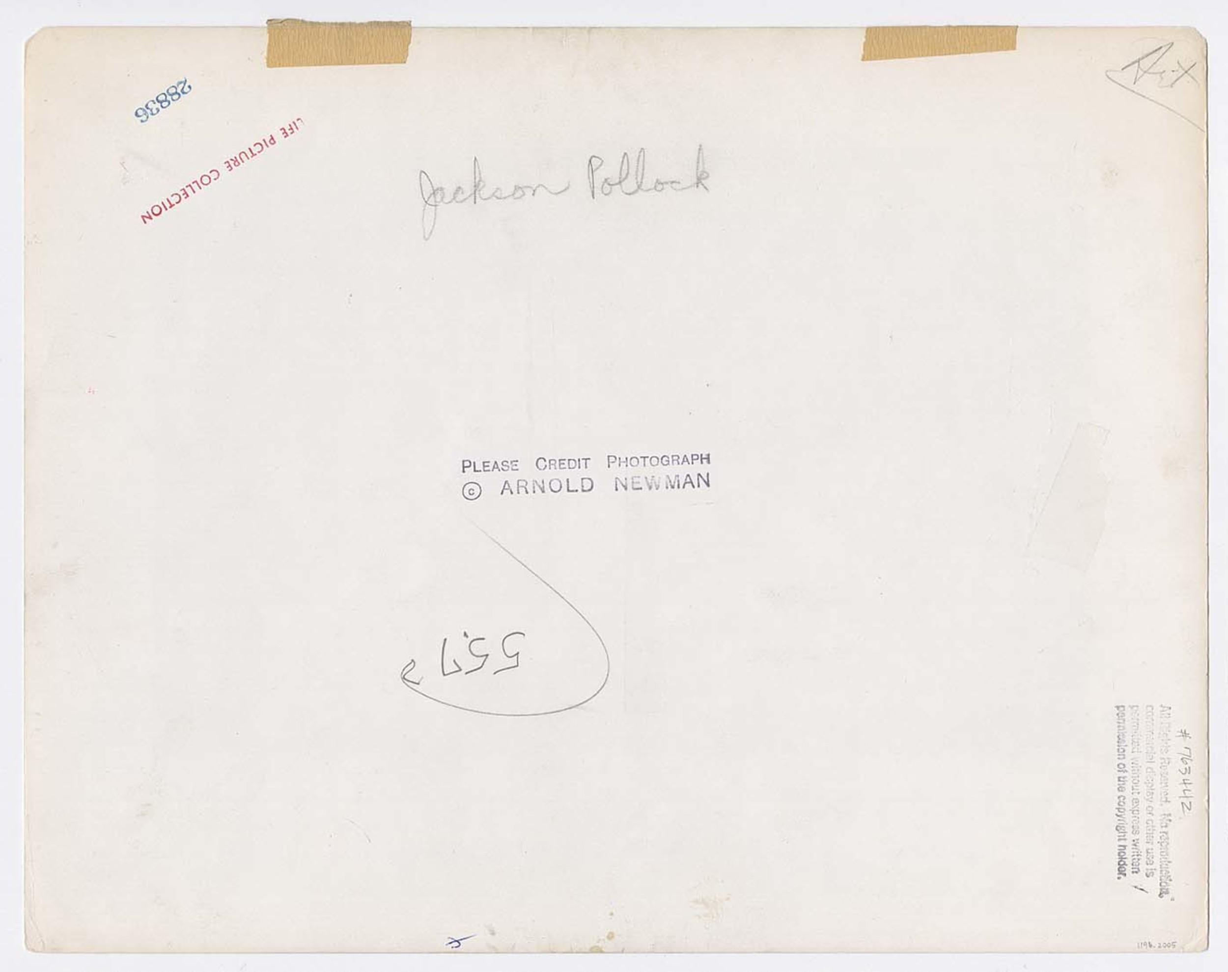 [Jackson Pollock standing in front of one of his paintings ...