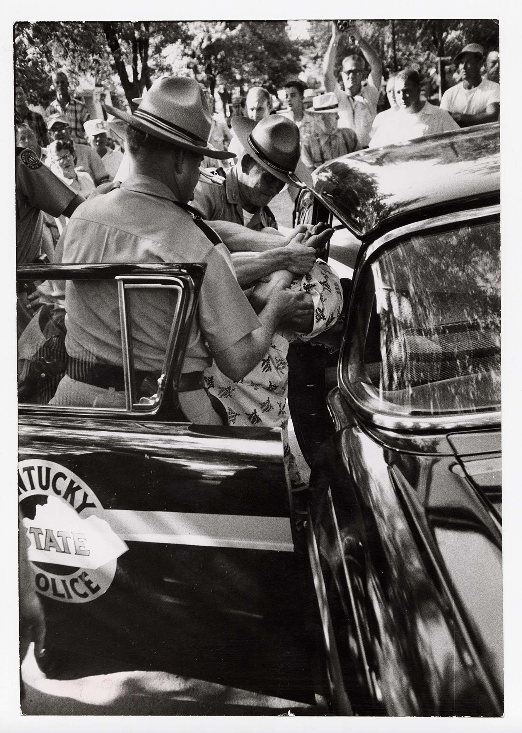 [State policemen forcing Madge Lucas into patrol car after disrupting ...
