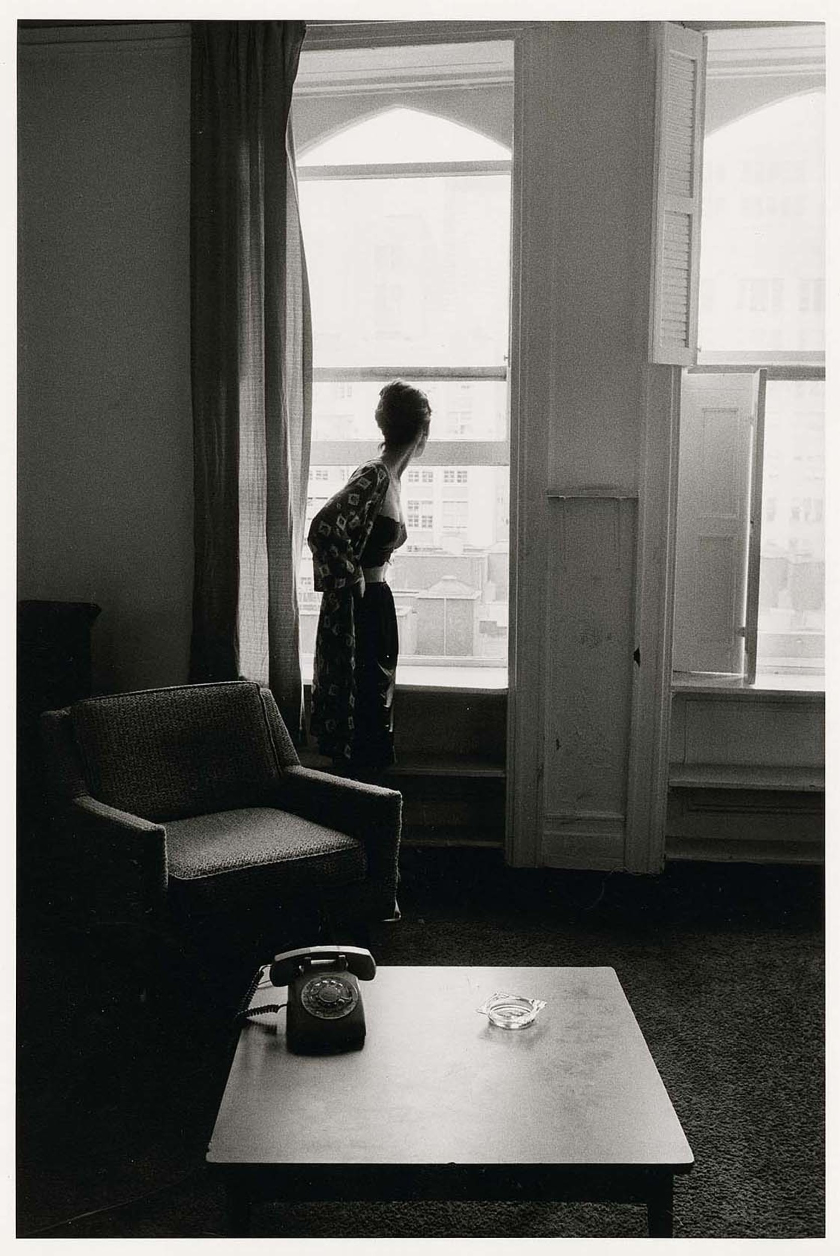 [Woman in lingerie and robe looking out window] | International Center ...