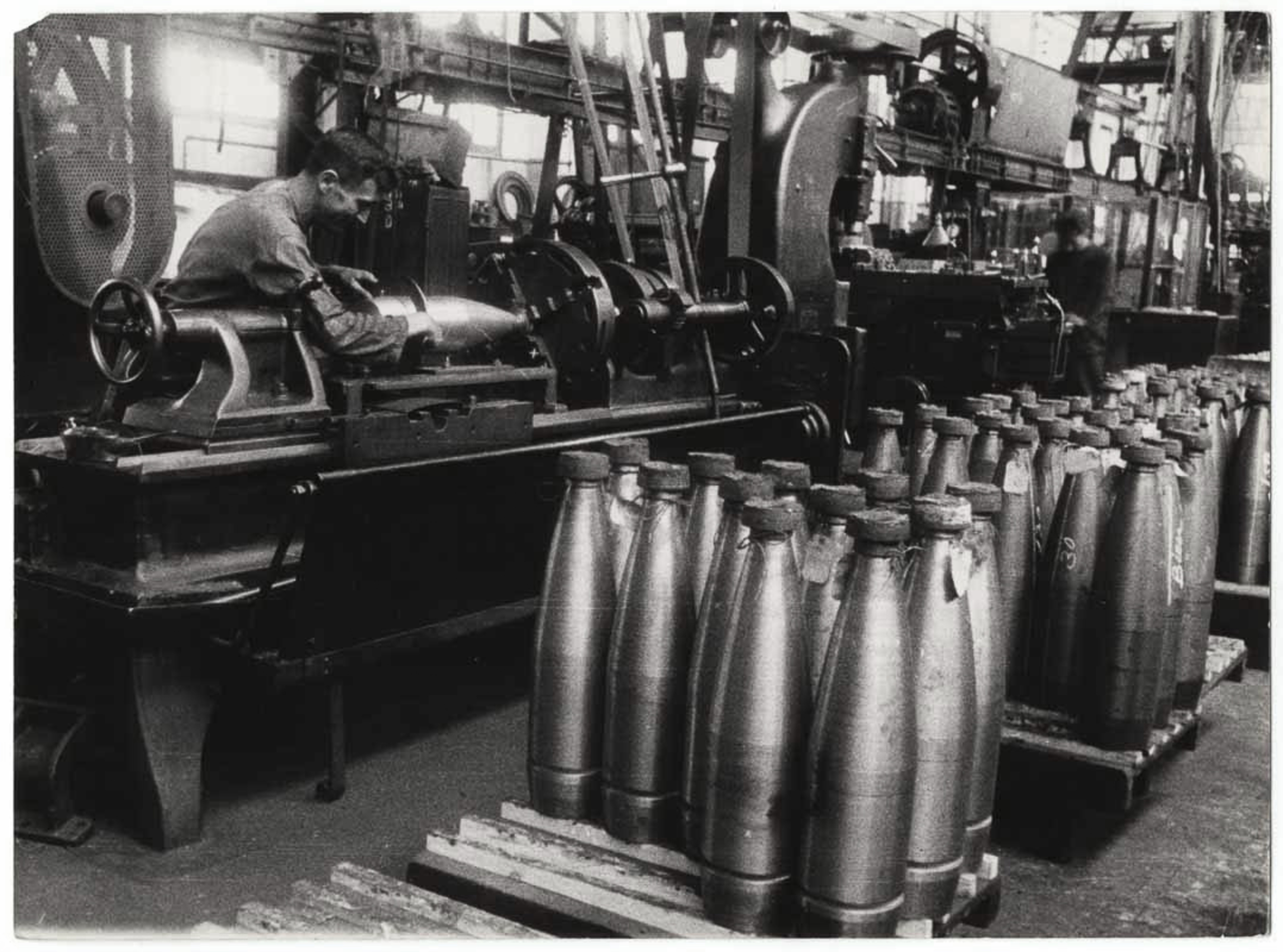 [Men working on bomb casings in a munitions factory, Spain ...
