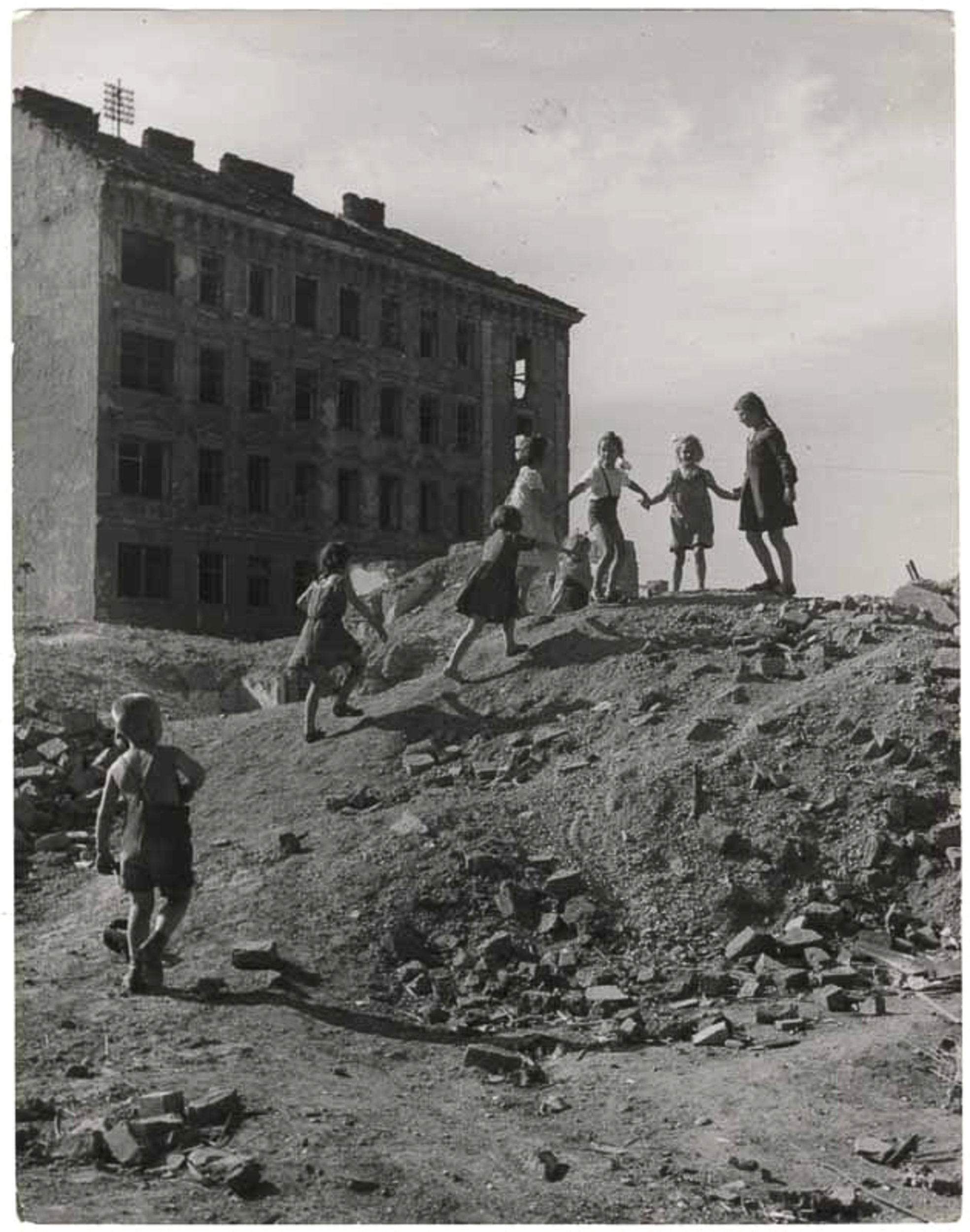 [Children playing on a pile of rubble among the ruins, Vienna, Austria ...