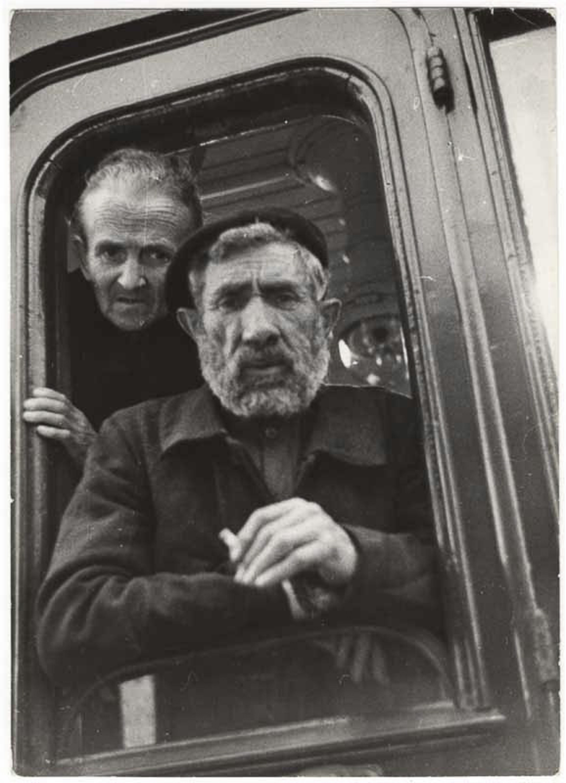 [Two old refugees on a train window at Spain-France border, Cerbere ...
