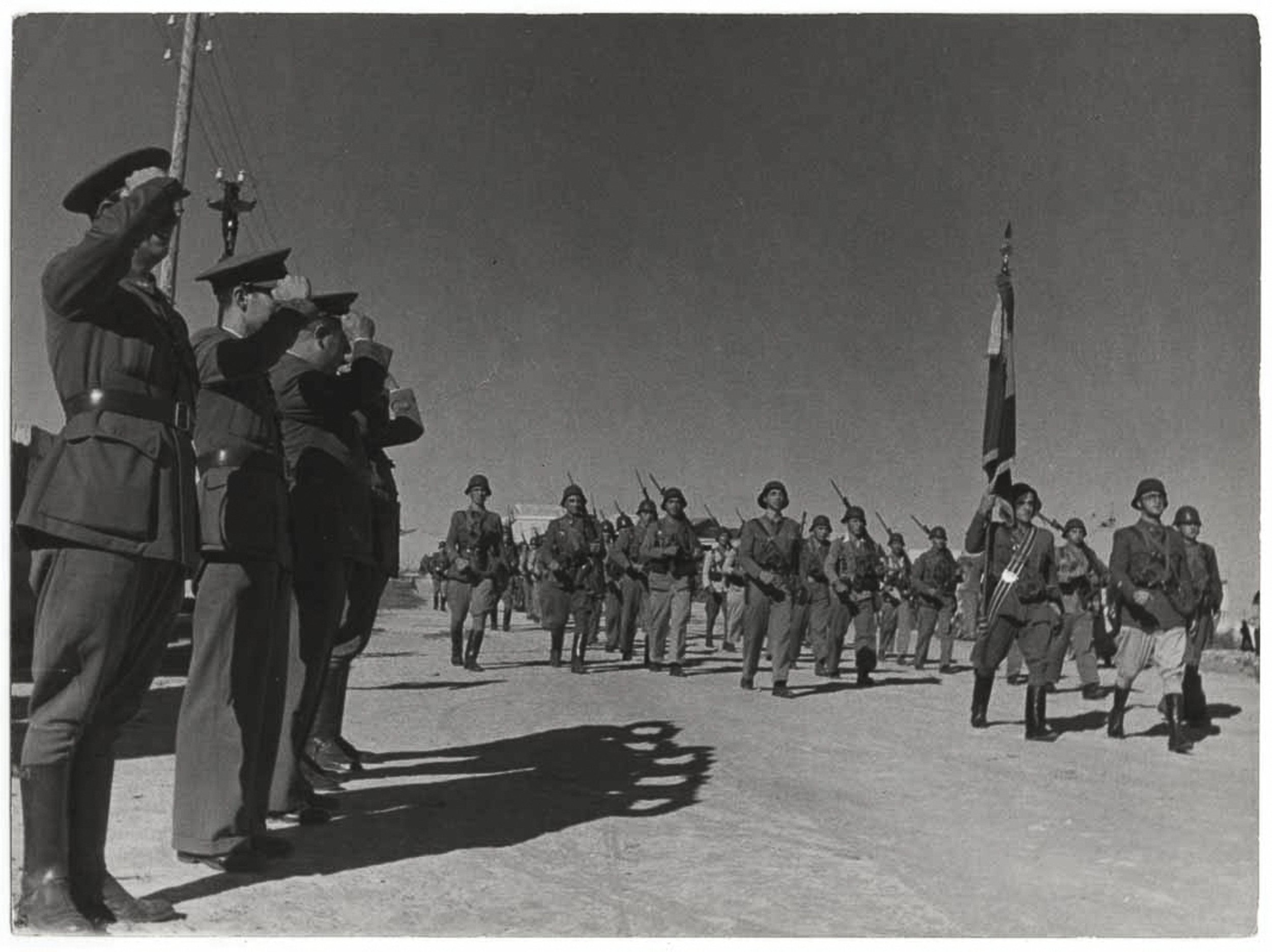 [Army soldiers march in a parade with guns and a flag, soldiers ...