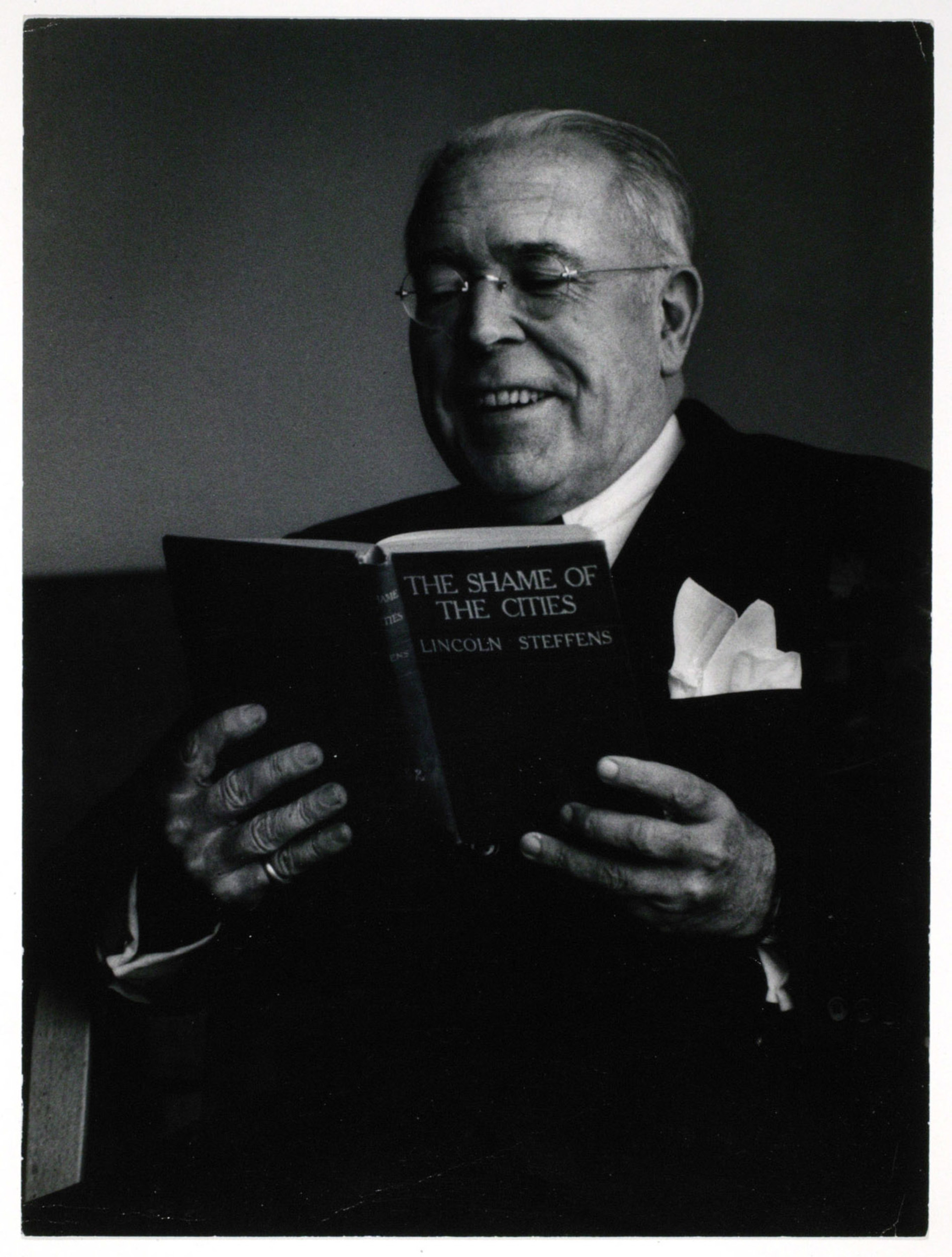 David L. Lawrence, Pittsburgh mayor, reading 'The Shame of the Cities ...