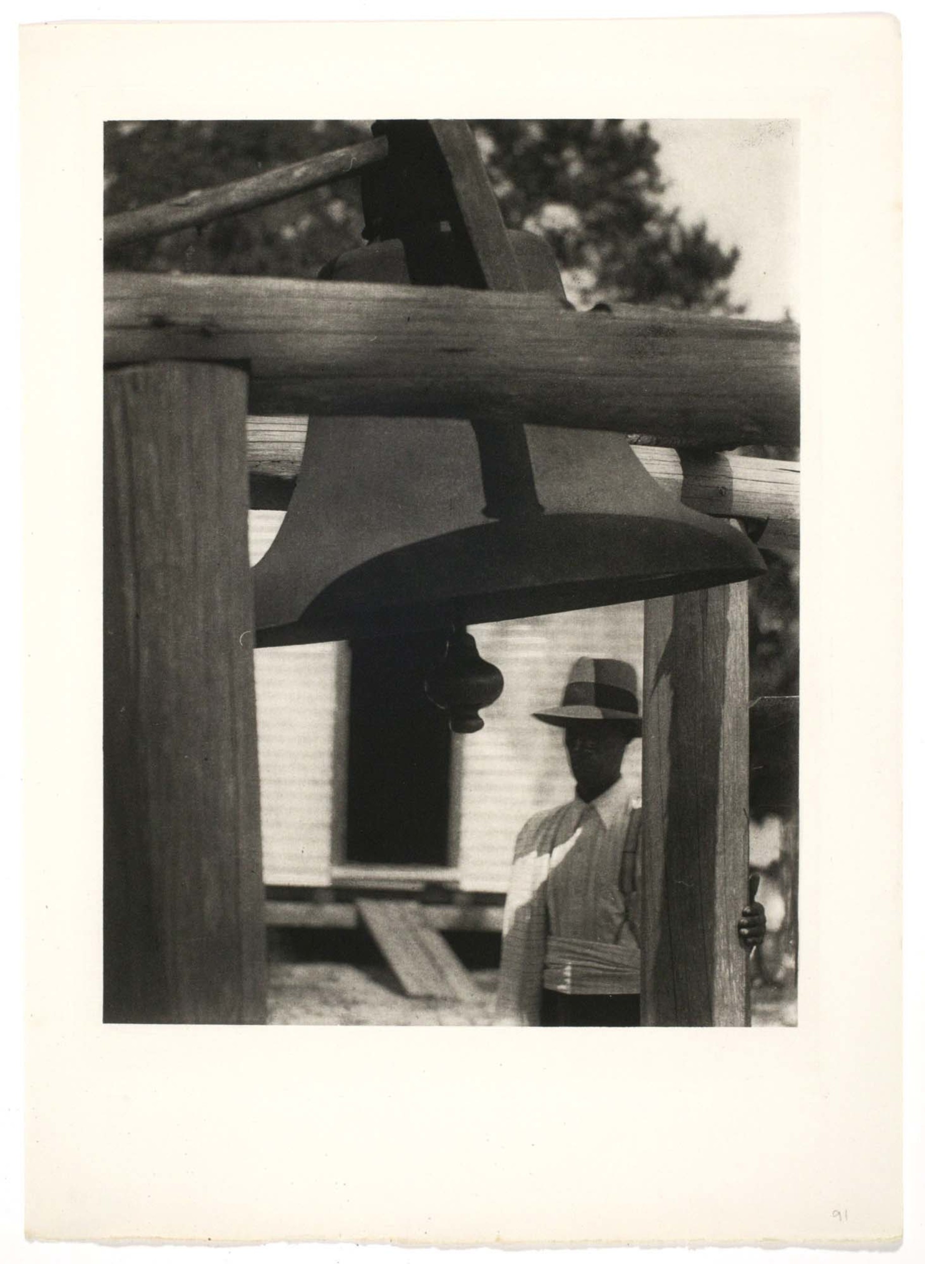 [Man with bell] | International Center of Photography