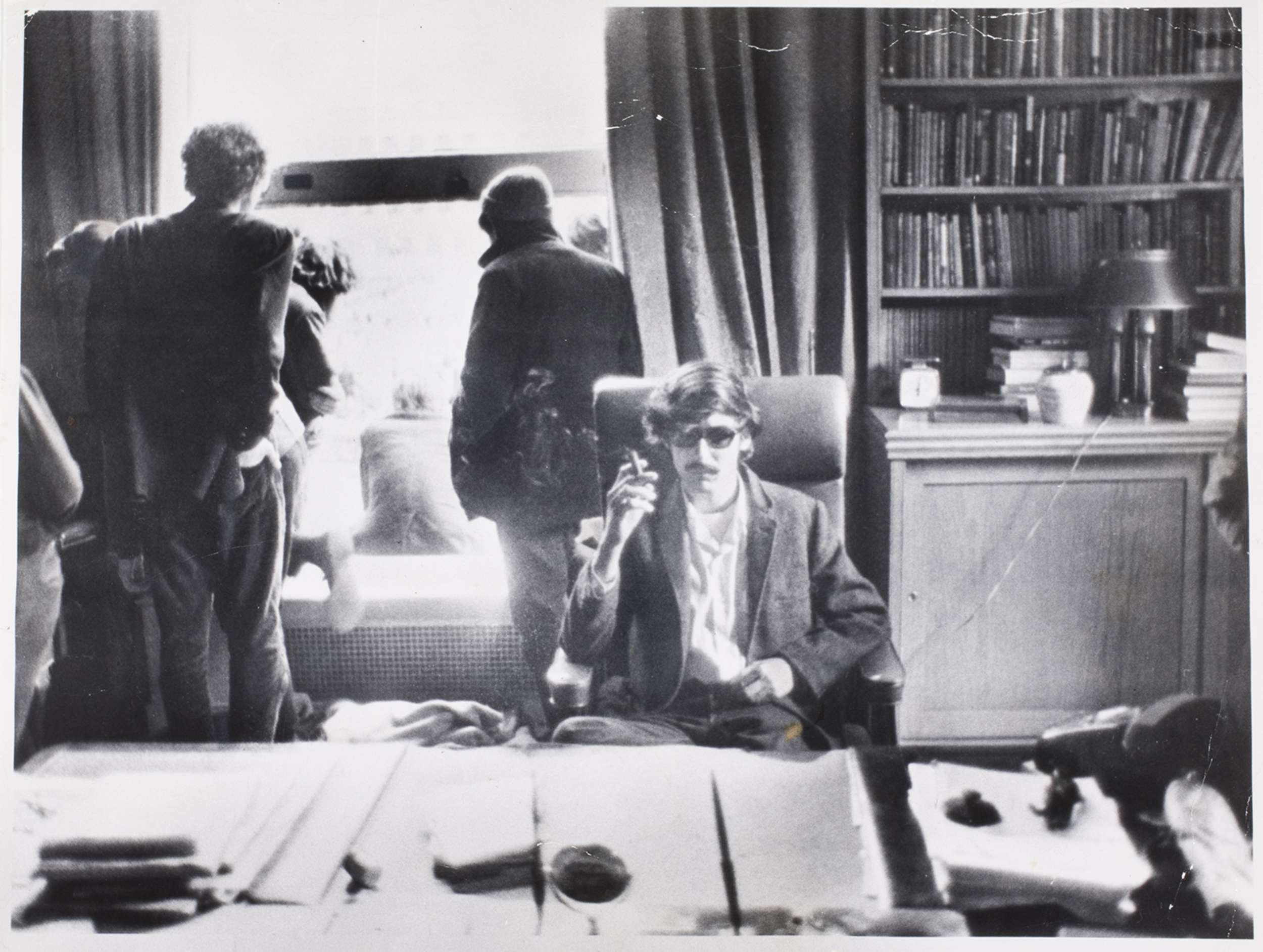 [Student activist David Shapiro sitting behind University President ...