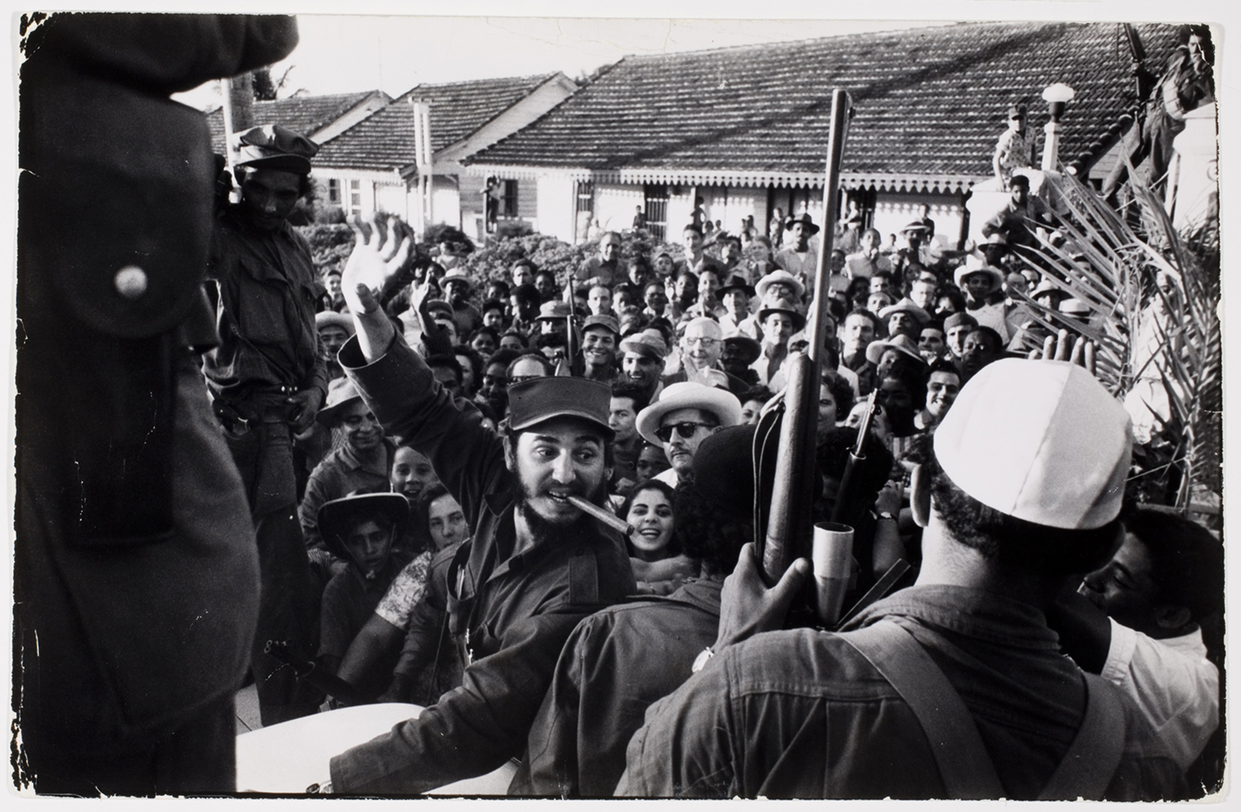 [Fidel Castro waving to cheering crowd on his victorious march to ...