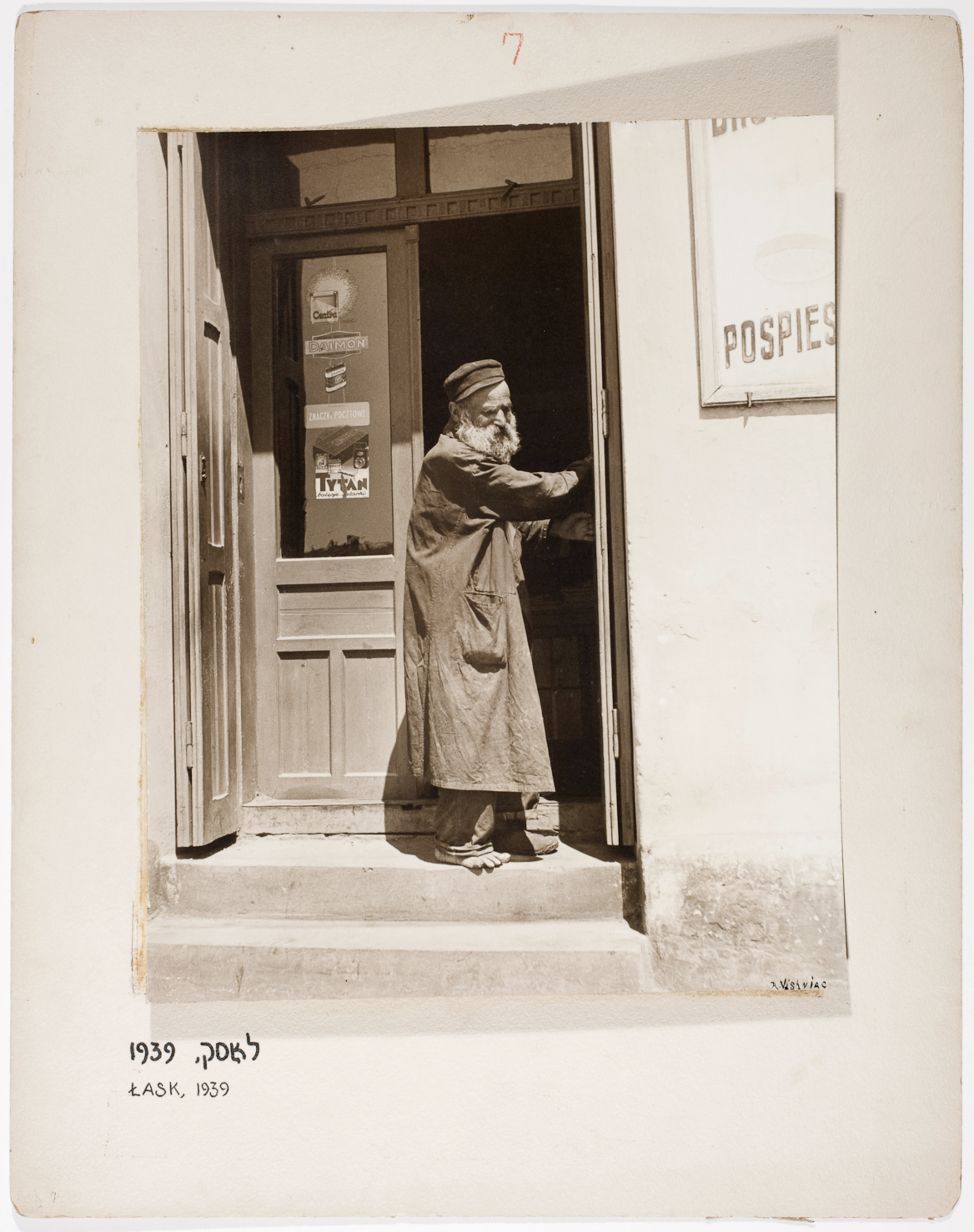[Beggar standing outside Jewish printing shop during the Polish ...
