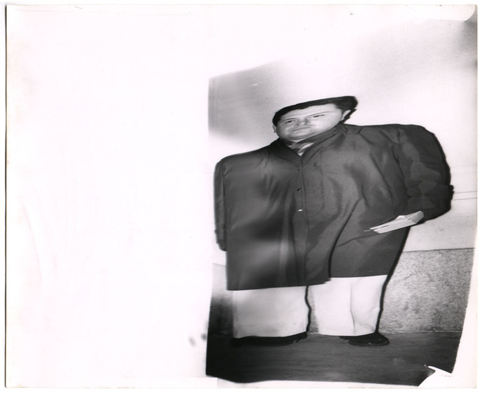 Man standing outside against wall (distortion) | International Center ...