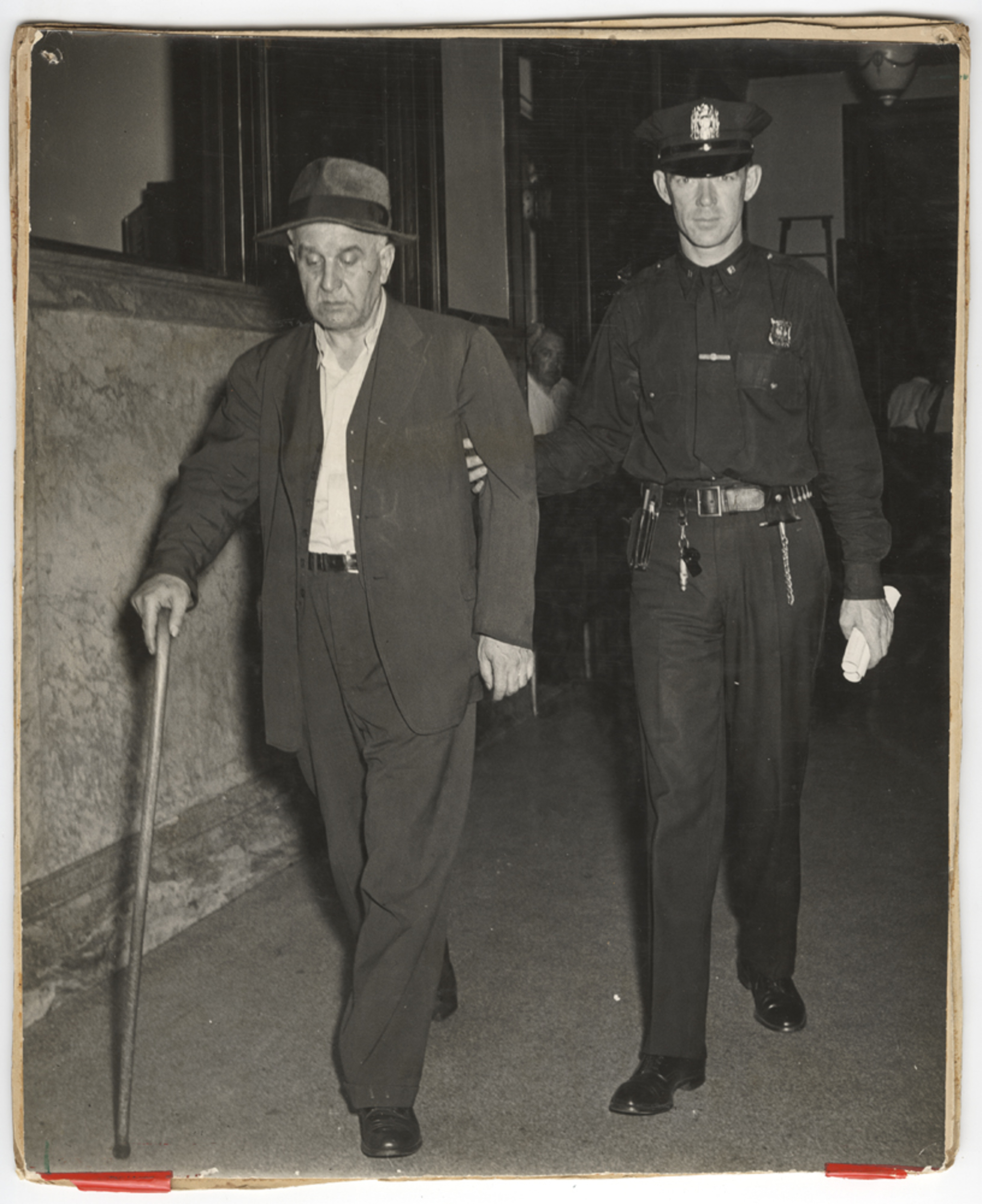 [Police officer who looks like Gary Cooper booking blind man for muder ...