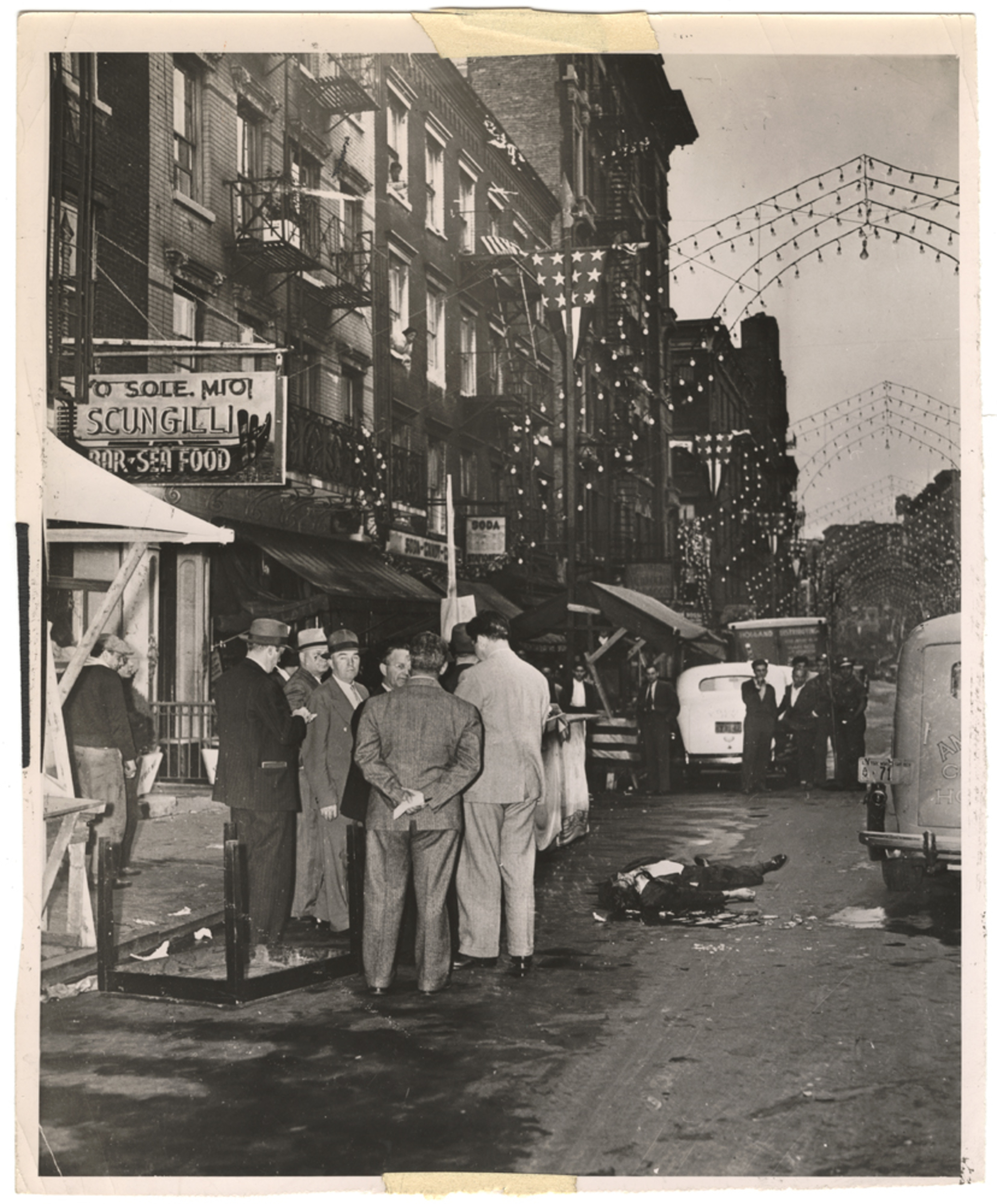 [Police and bystanders with body of racketeer Joseph (Little Joe) La ...