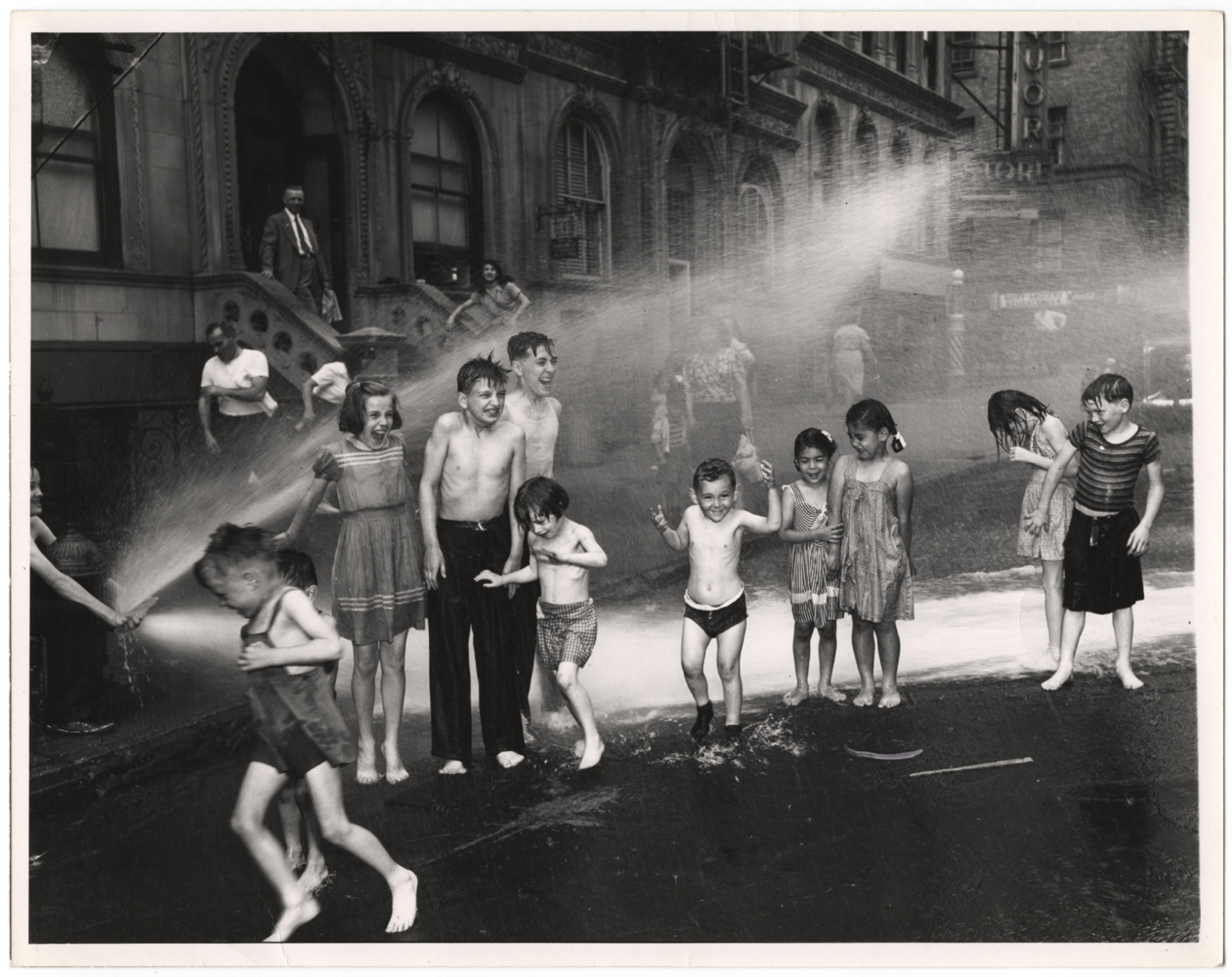 [Children playing in water sprayed from open fire hydrant, Uppr West ...