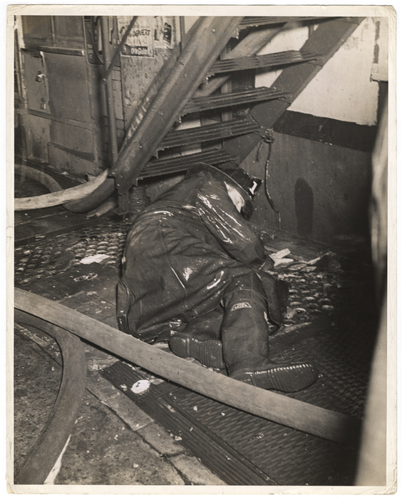 "A fireman collapses at fire" | International Center of Photography