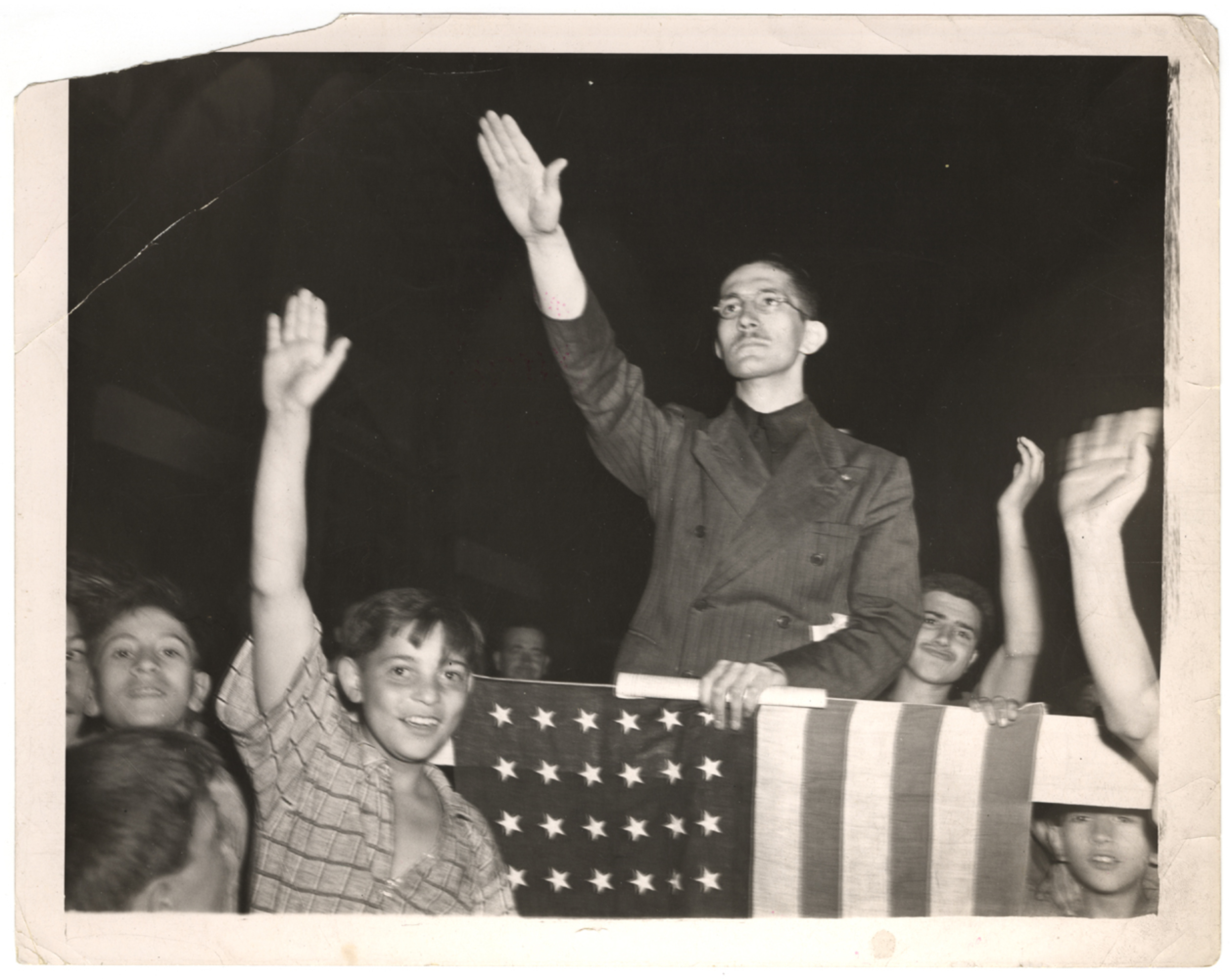 [Saluting with flag] | International Center of Photography