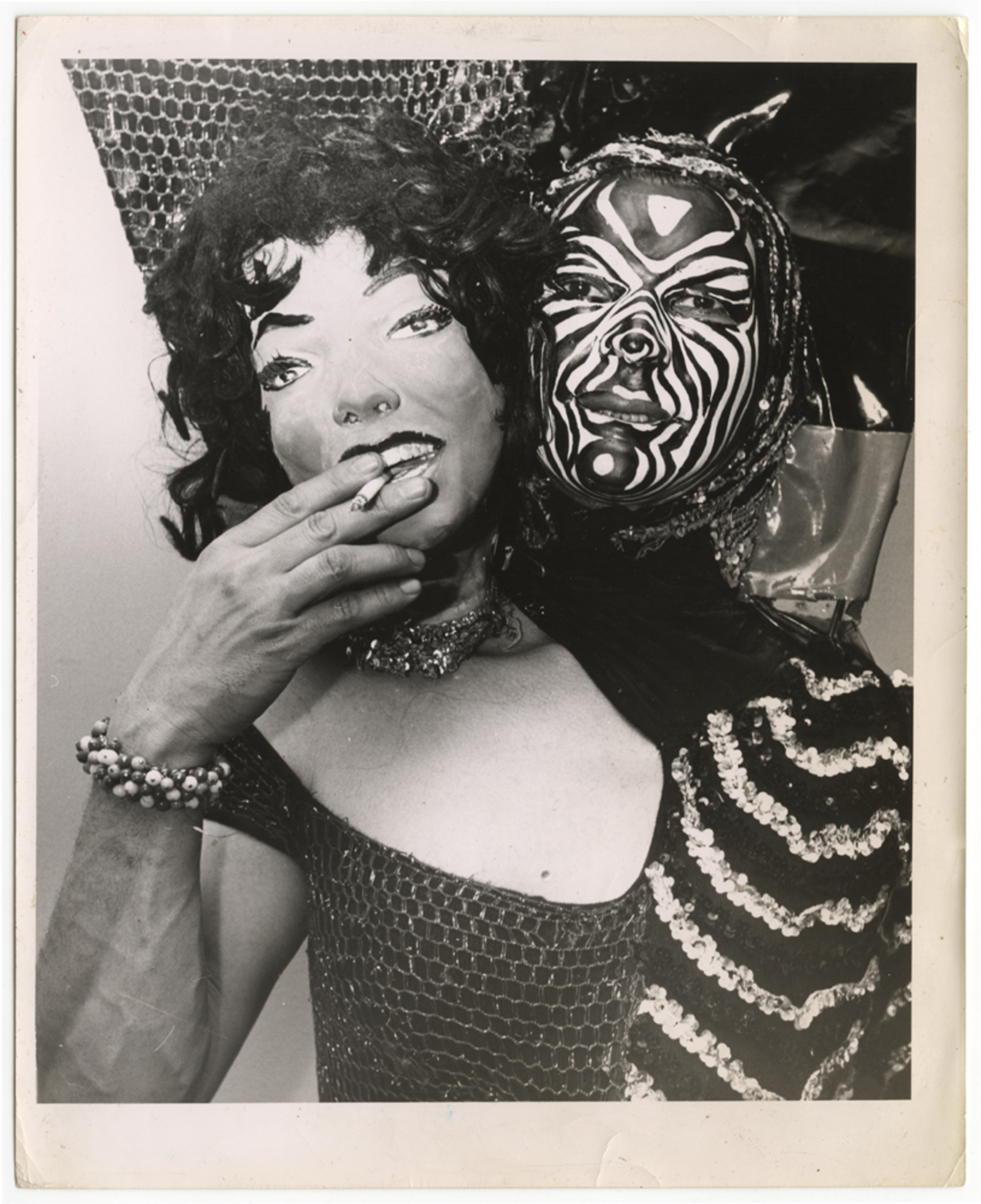 [man wearing two headed costume smoking] | International Center of ...