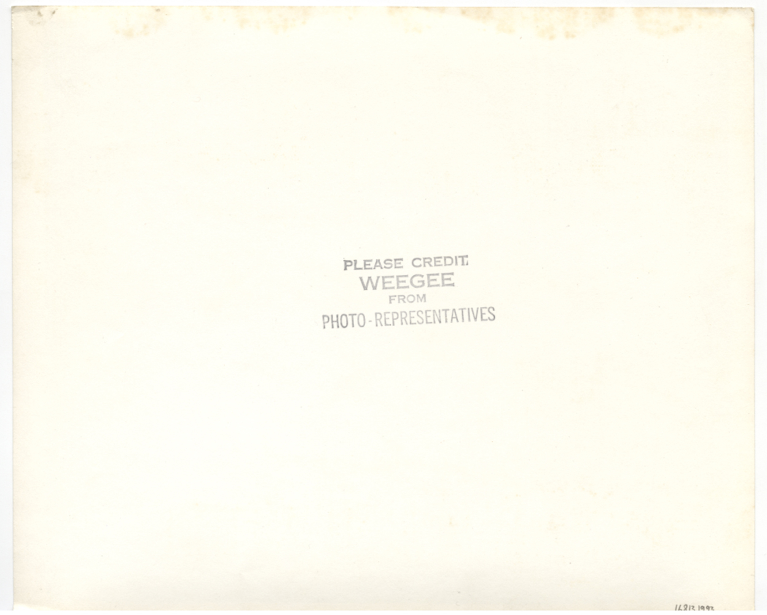 [man wearing two headed costume seated] | International Center of ...