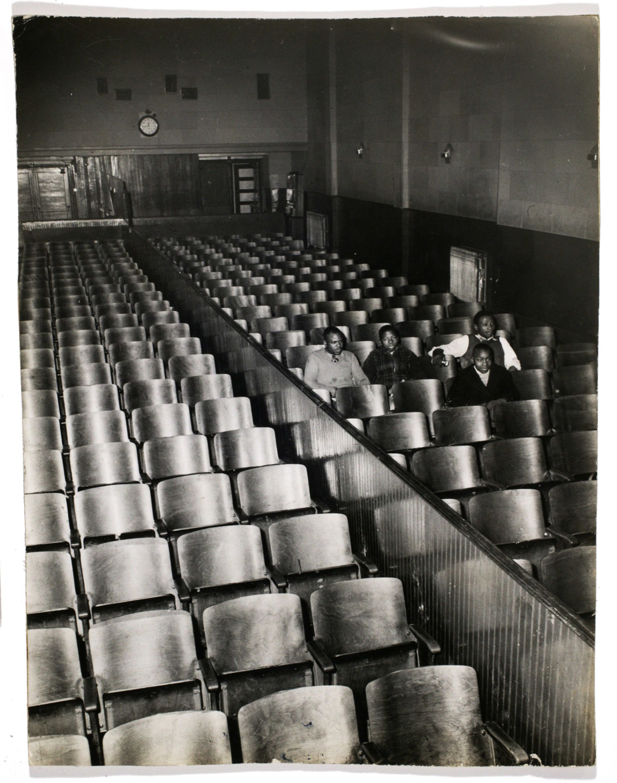 A movie theater. The partition separates the white and black patrons ...