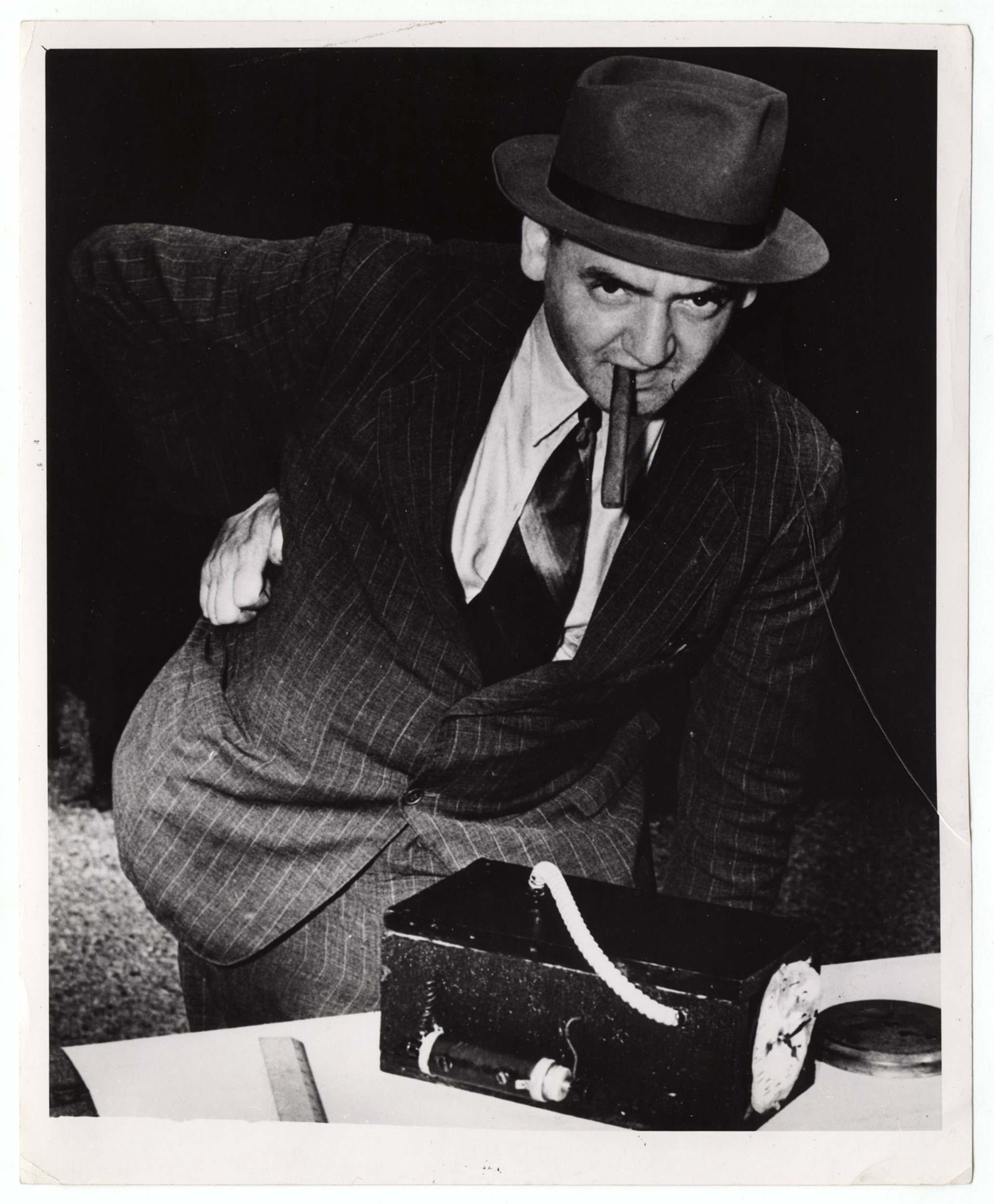 [Weegee with bomb] | International Center of Photography