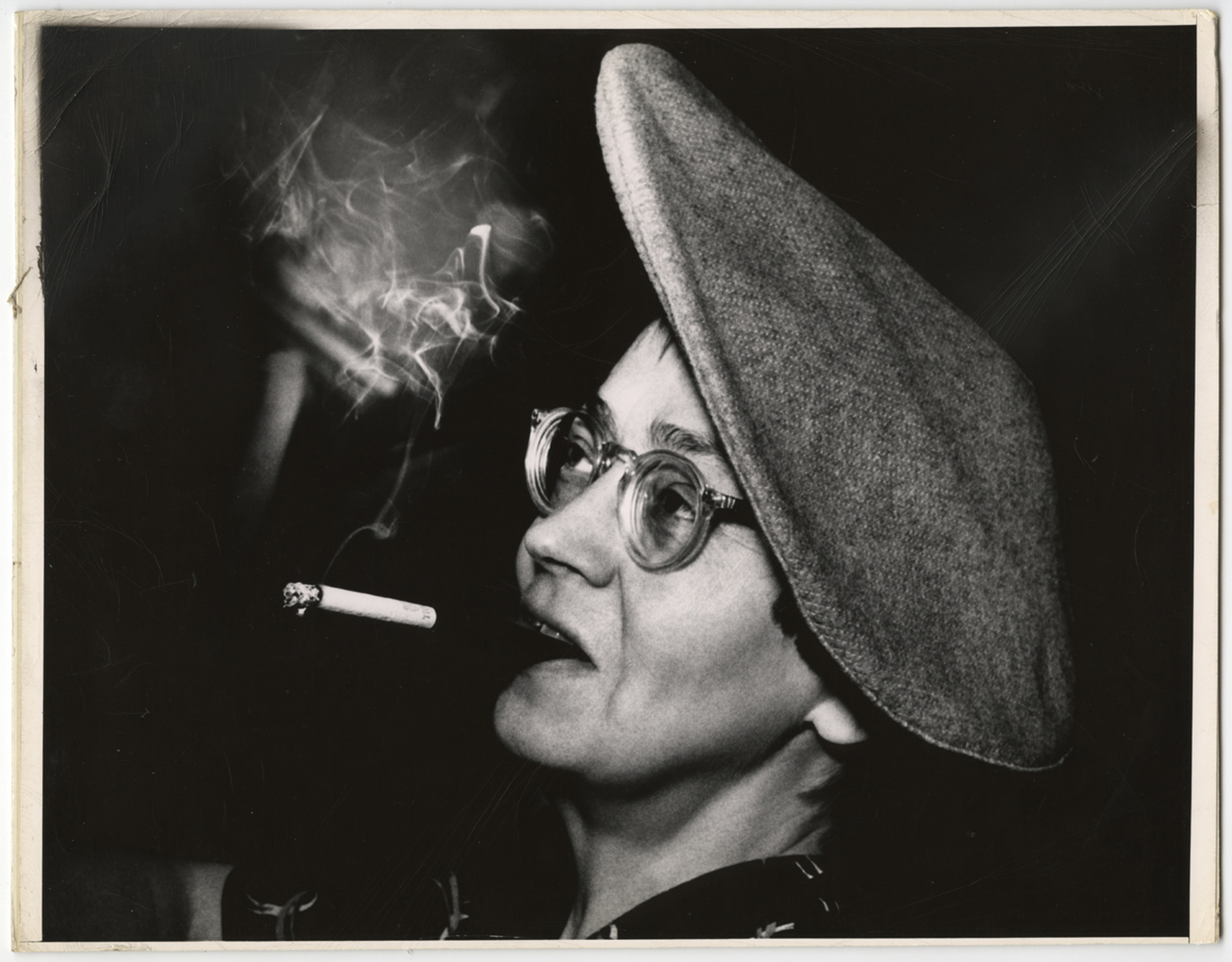 [woman with hat, smoking] | International Center of Photography